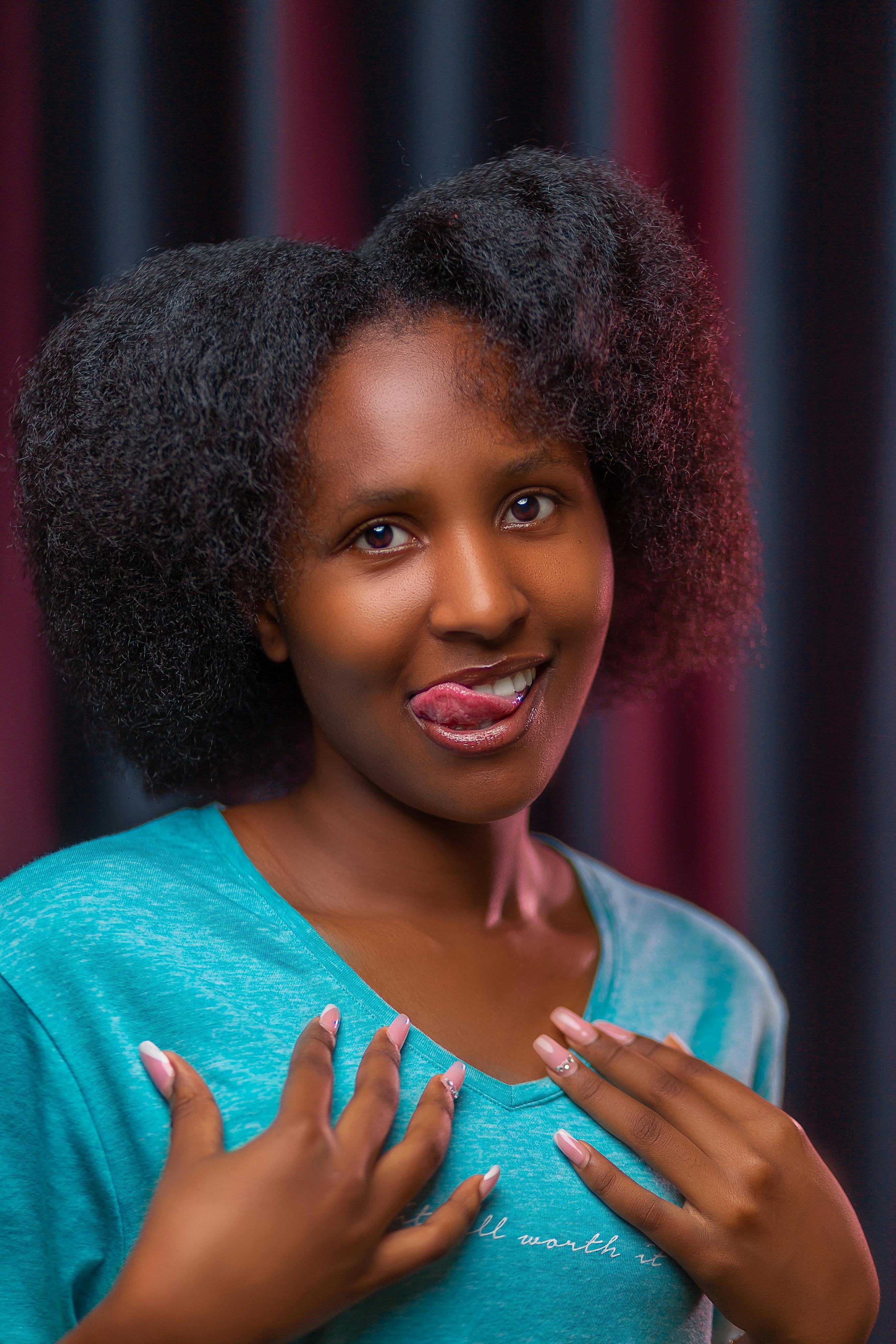 Young Woman Licking her Lip · Free Stock Photo