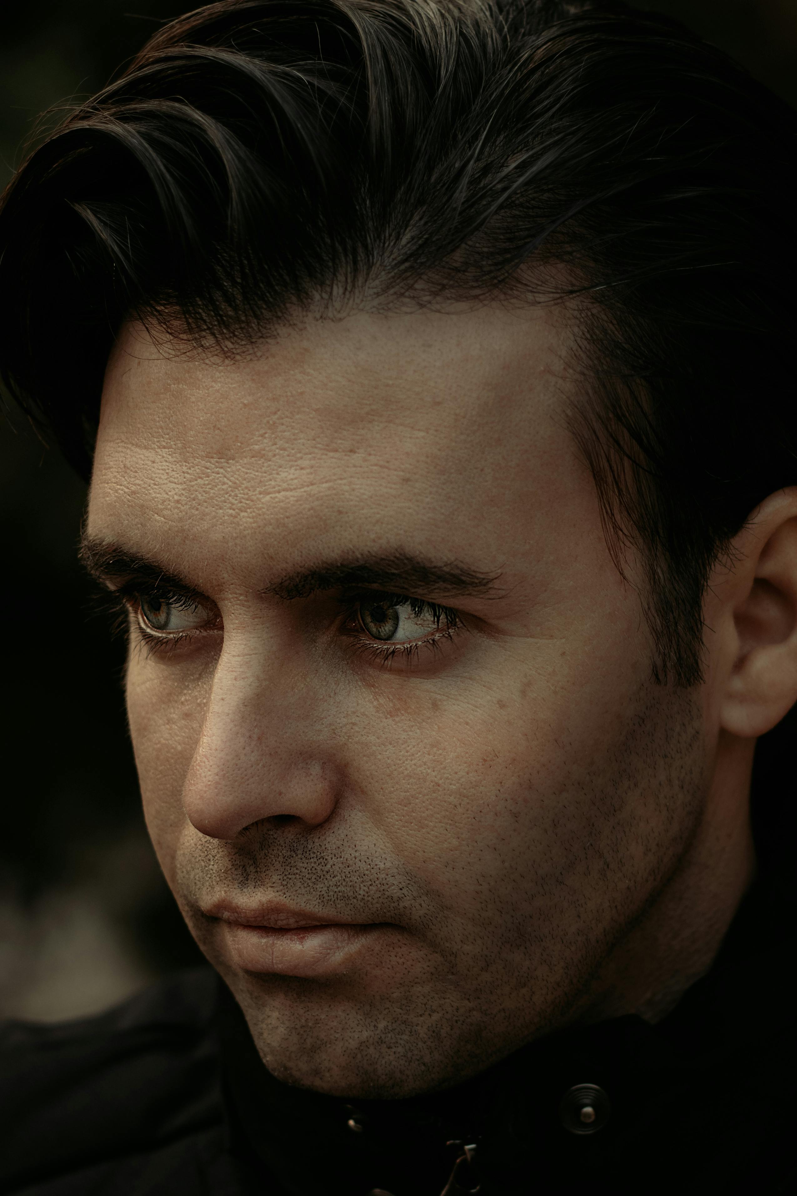 Headshot of a Man Looking Aside · Free Stock Photo