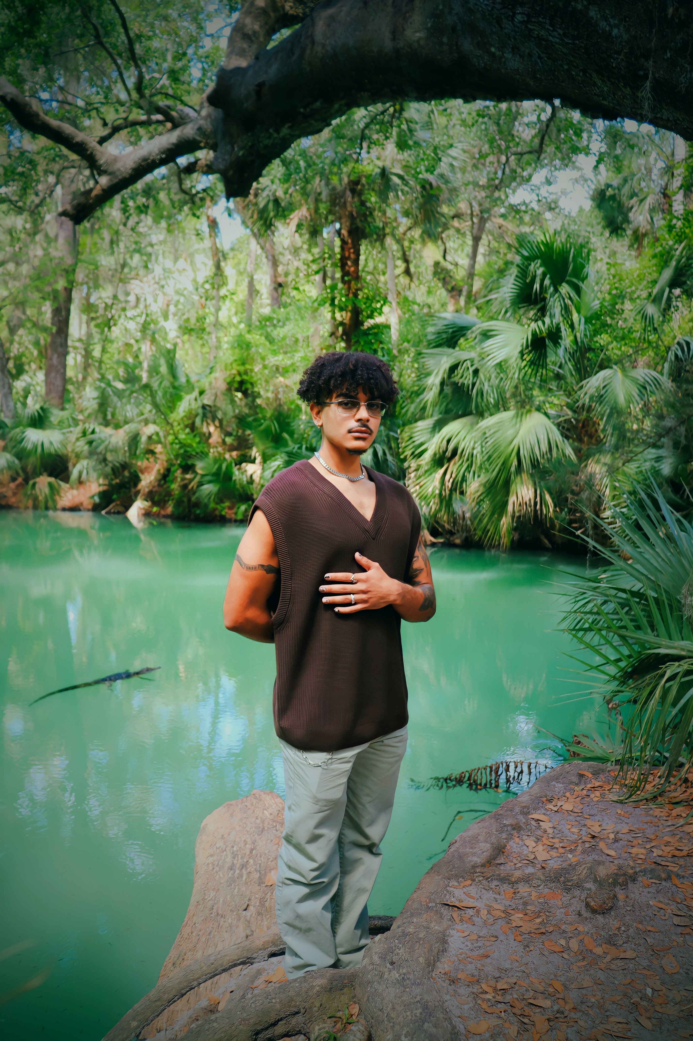 Man Standing near Water in Tropical Forest · Free Stock Photo