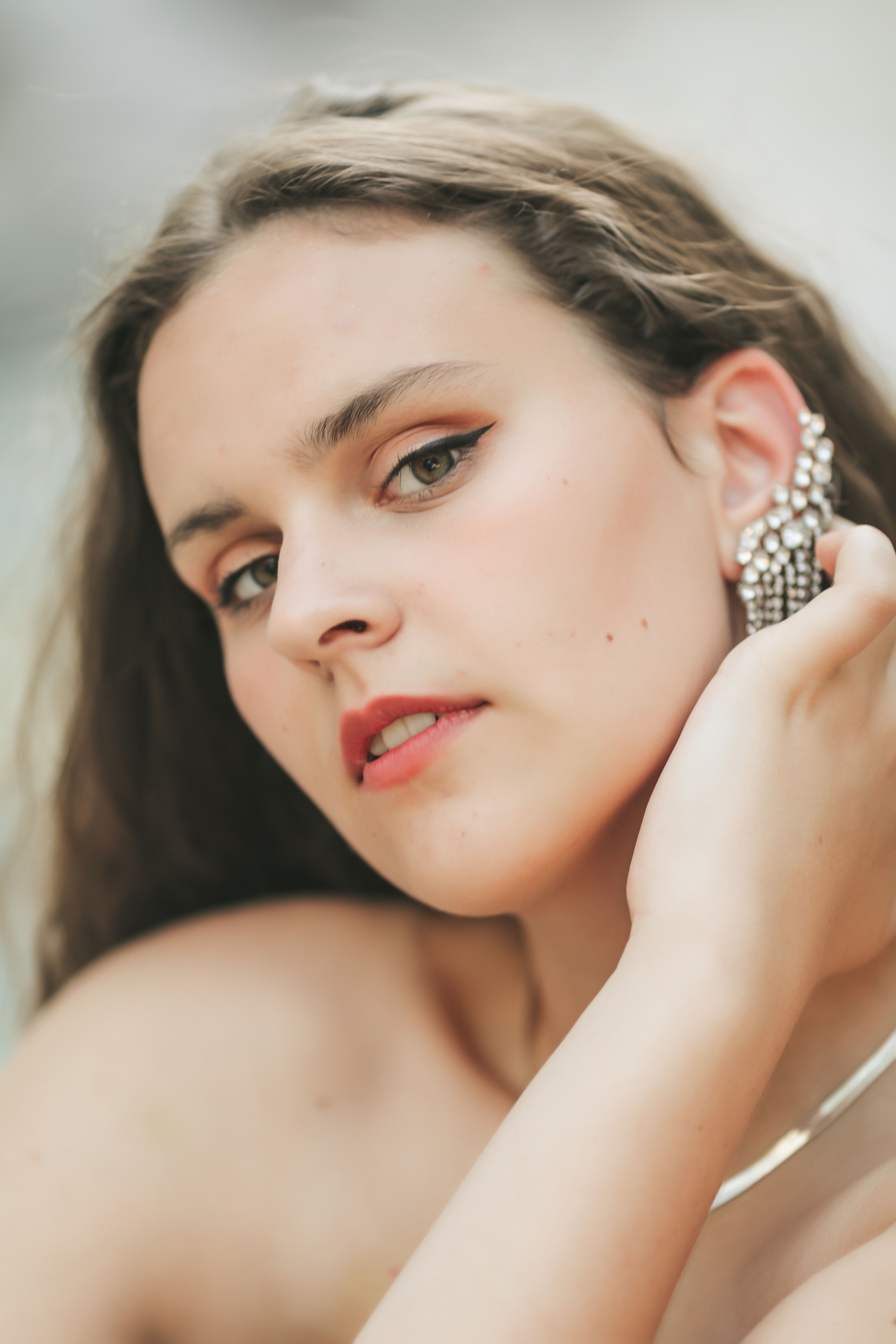 Woman Putting her Hair Behind her Ear · Free Stock Photo