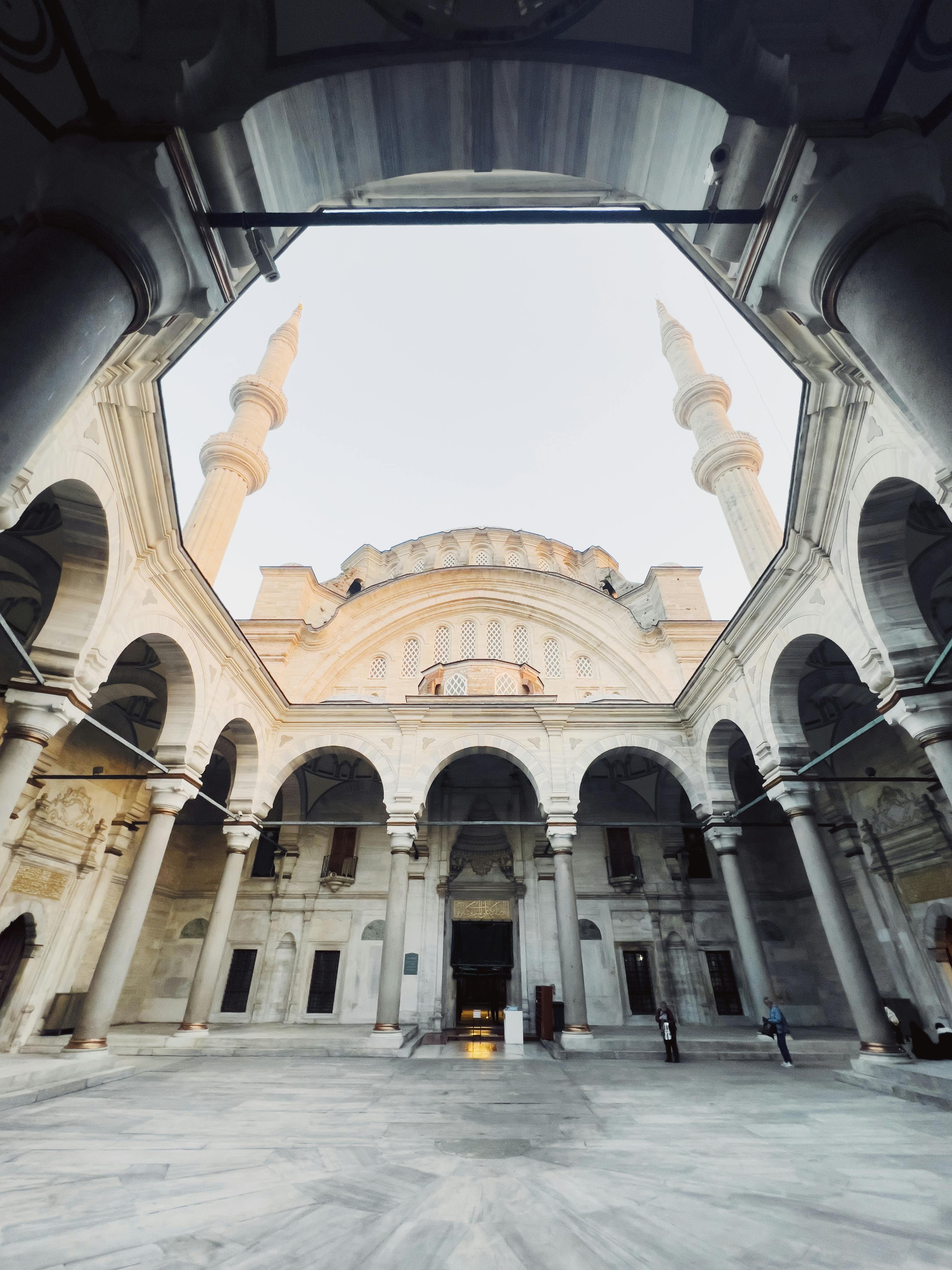 People on Mosque Courtyard in Evening · Free Stock Photo