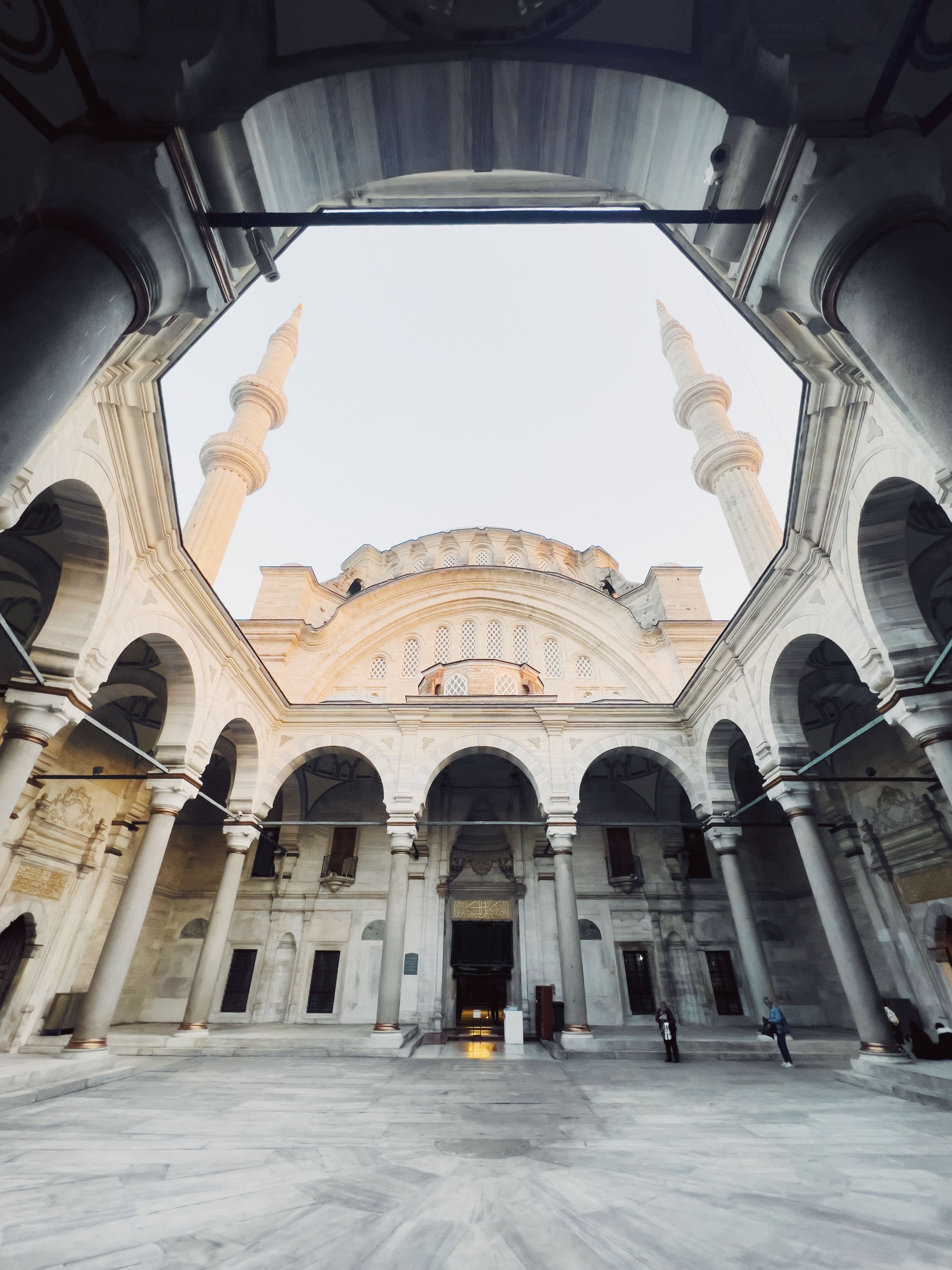 Courtyard and arched passage of medieval mosque · Free Stock Photo