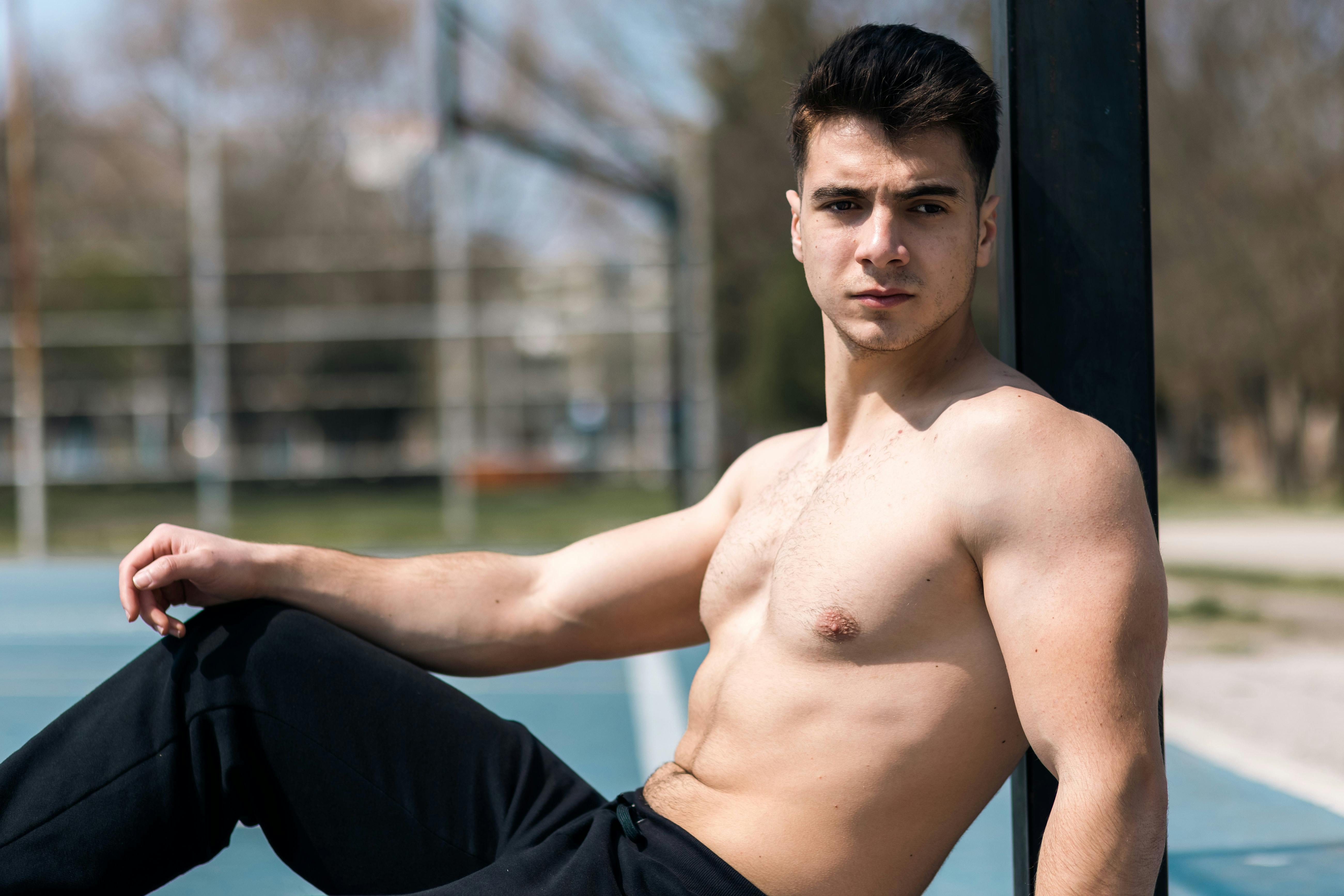 Man with Muscles Posing Topless · Free Stock Photo