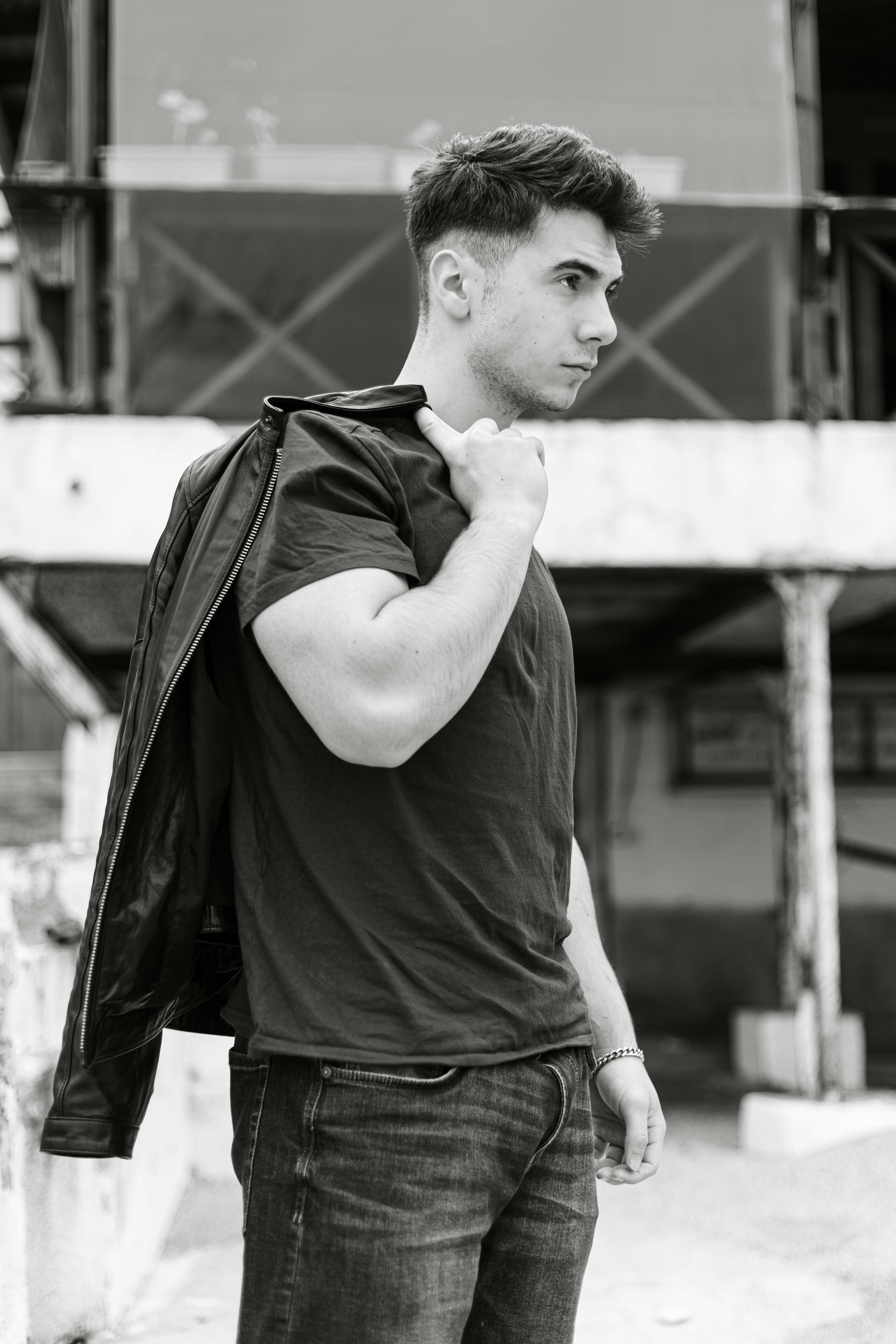 Man Standing and Posing with Jacket · Free Stock Photo