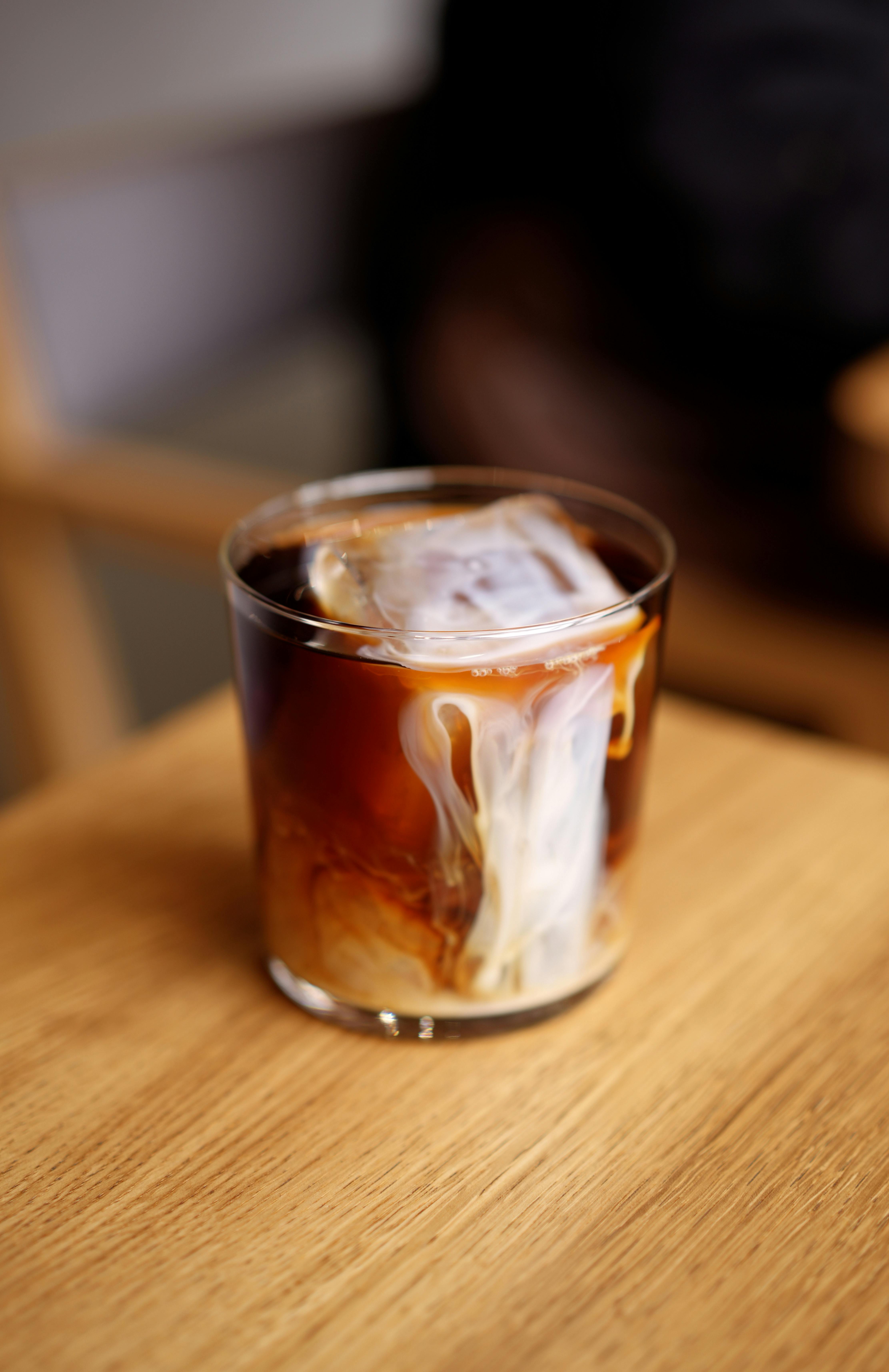 A Glass of Ice Coffee on a Wooden Table · Free Stock Photo
