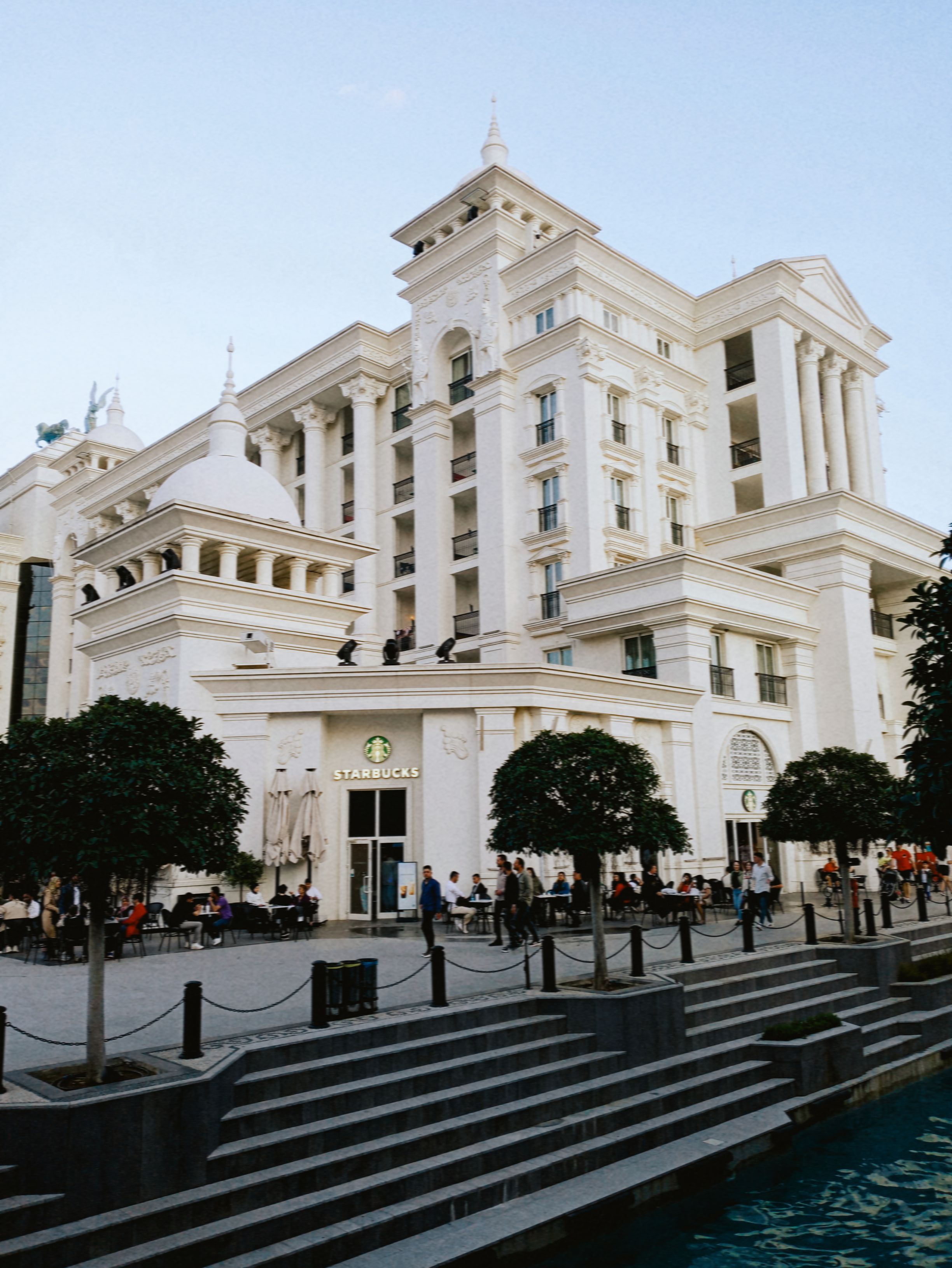 Starbucks in Monumental Classical Hotel Building · Free Stock Photo
