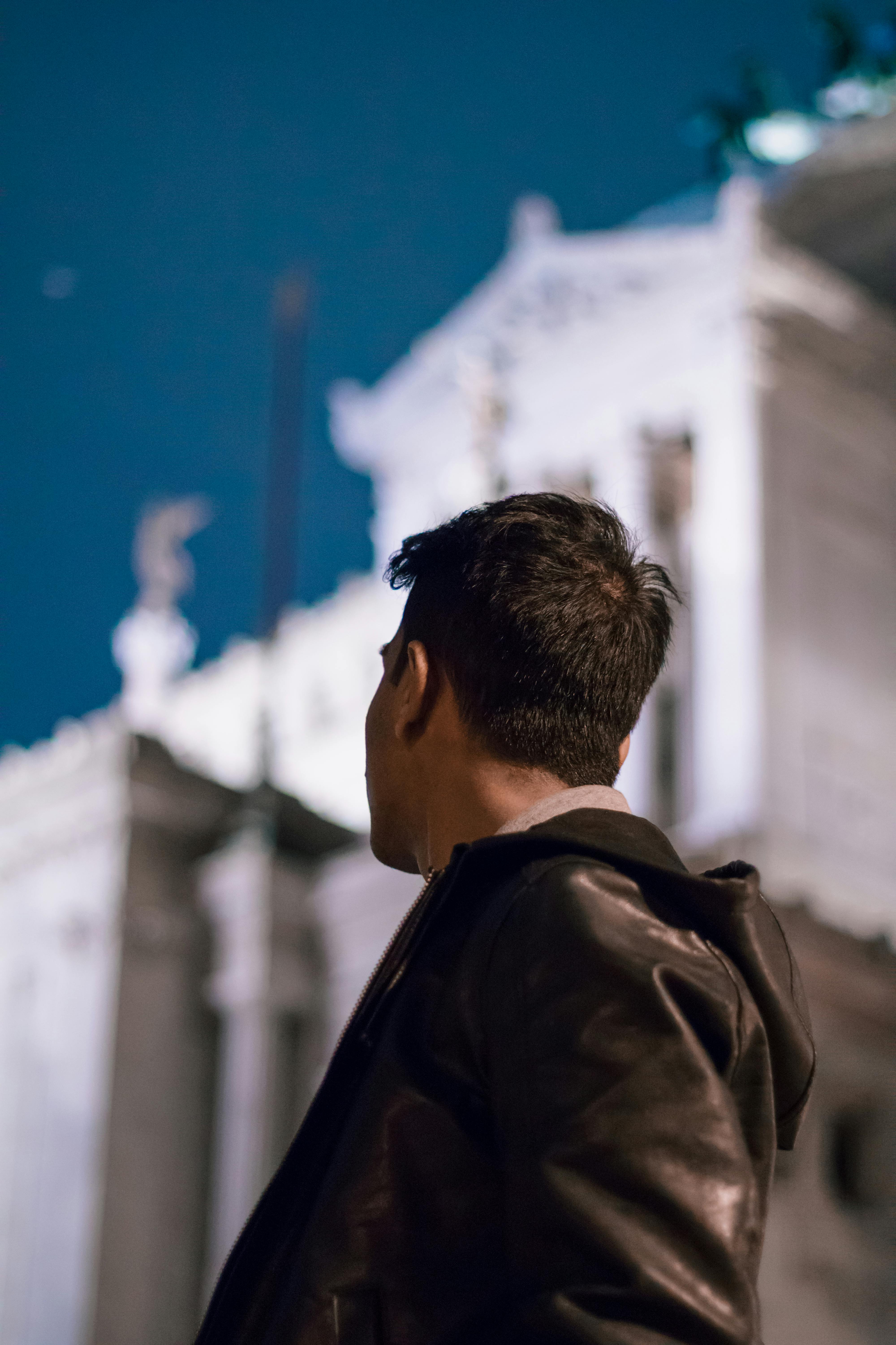Man Looking at White Concrete Building · Free Stock Photo