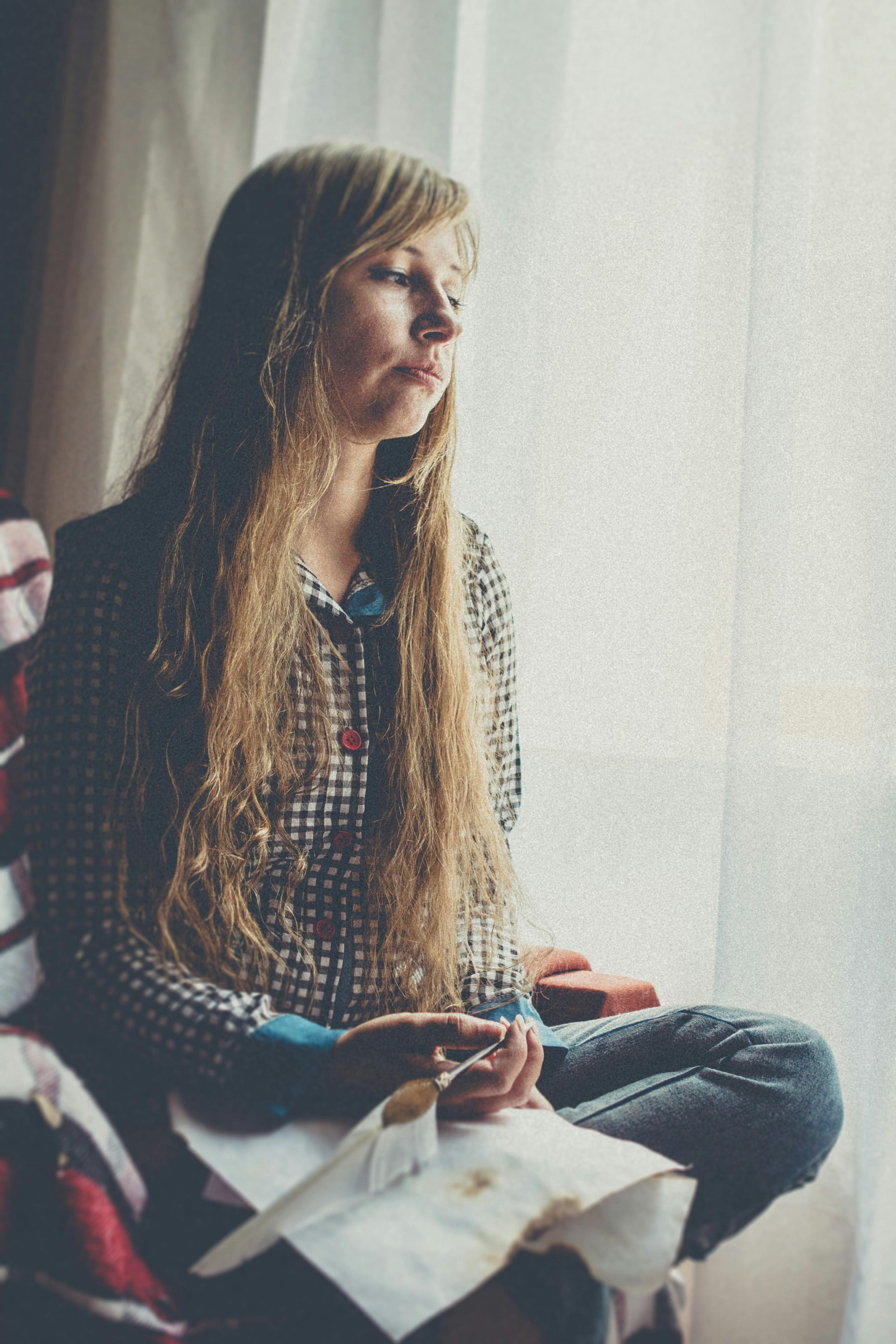 Woman Sitting Near Window · Free Stock Photo