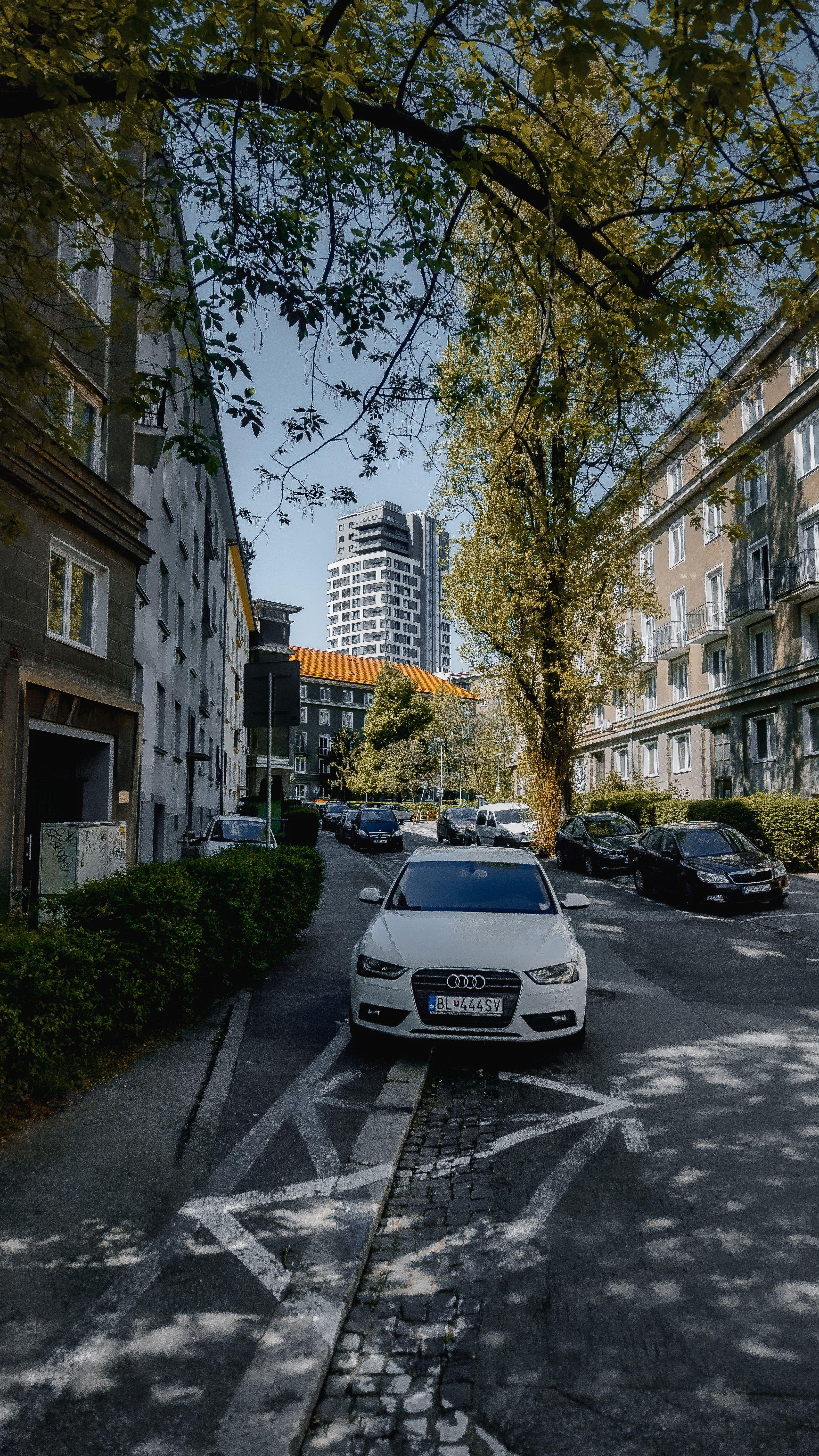 A Street in City between Residential Buildings · Free Stock Photo