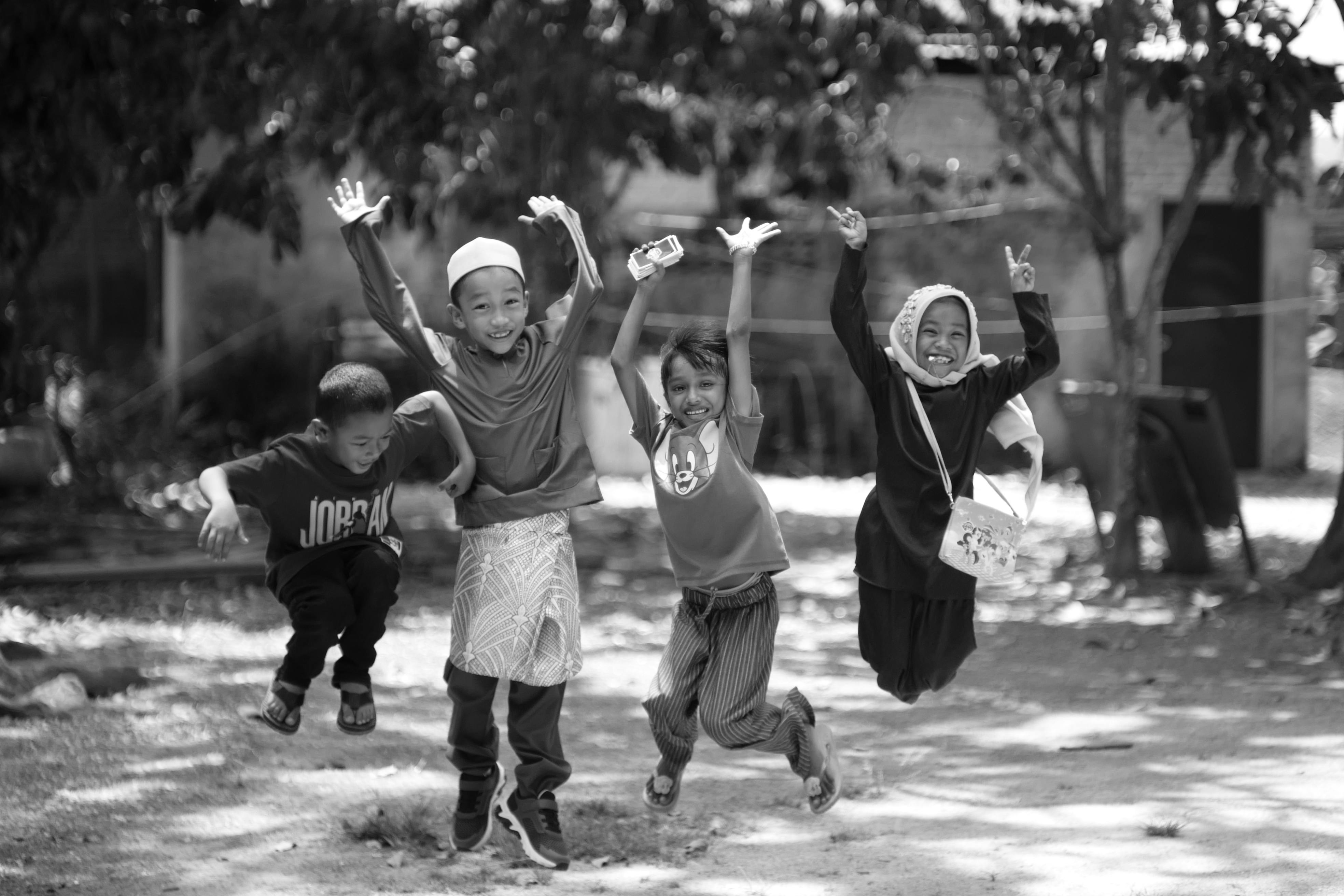 Black and White Photo of Jumping Children · Free Stock Photo