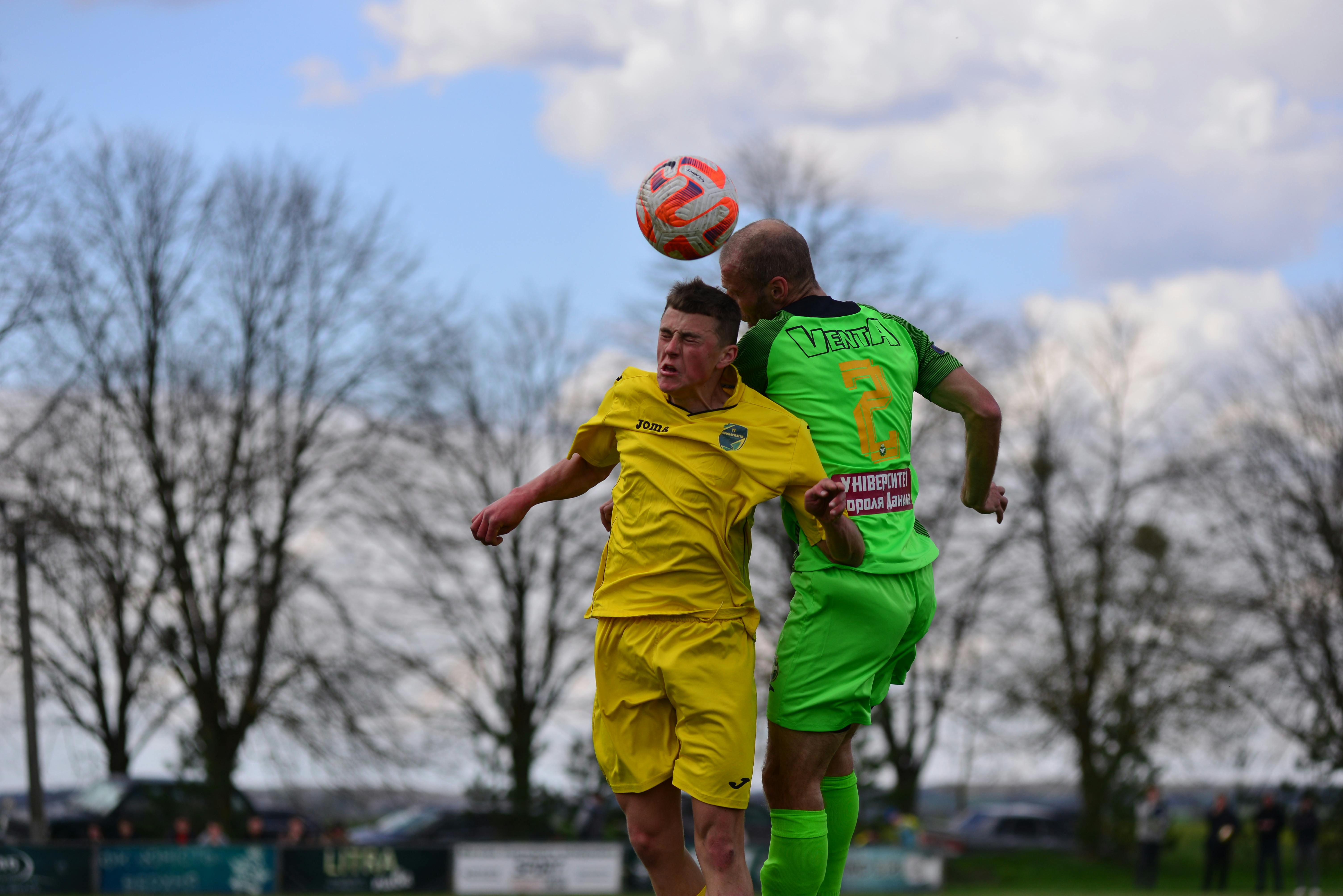 Two Man Jumping to Hit the Ball with Their Heads · Free Stock Photo