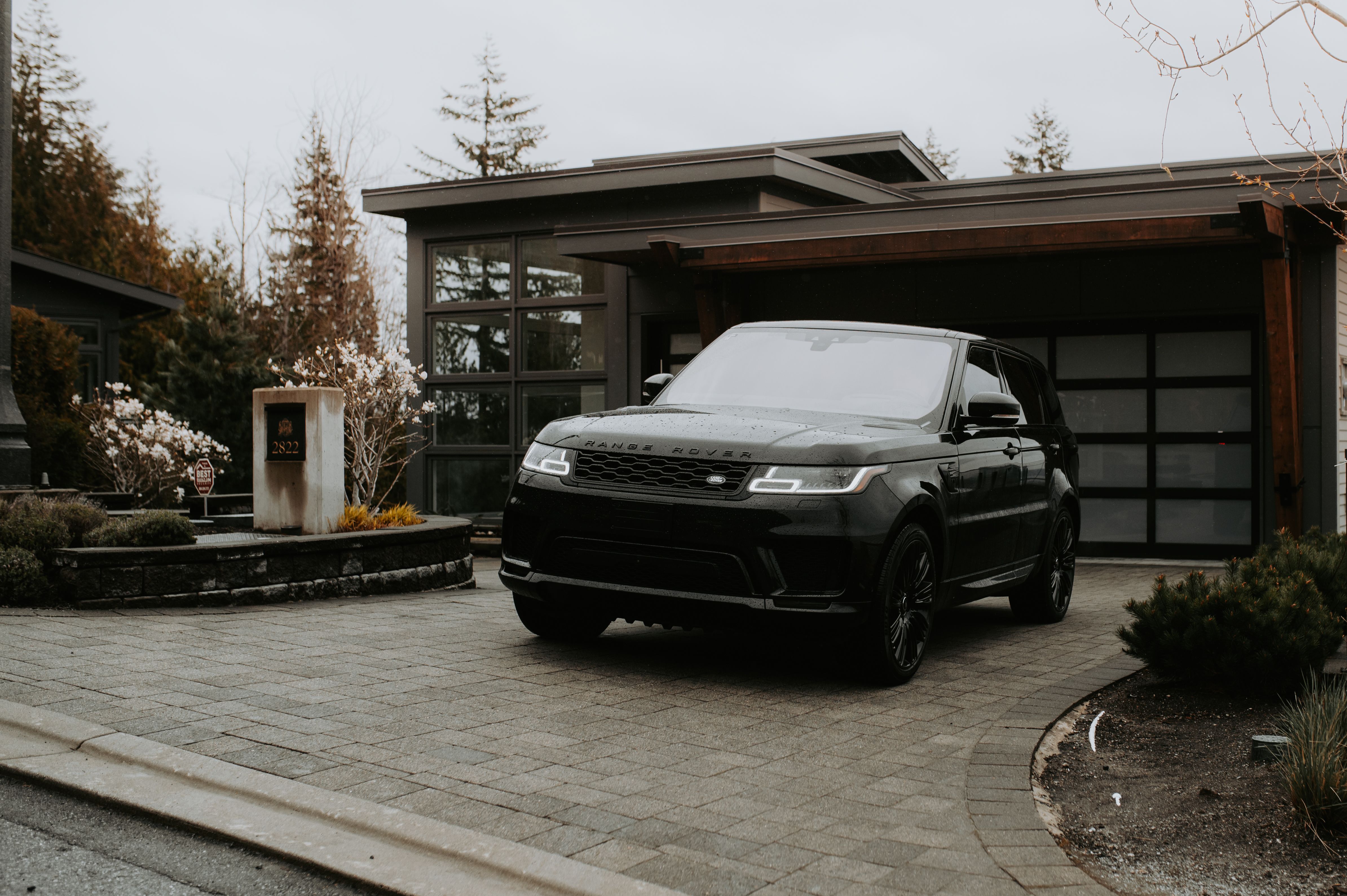 Black SUV Car Parked in the Driveway · Free Stock Photo