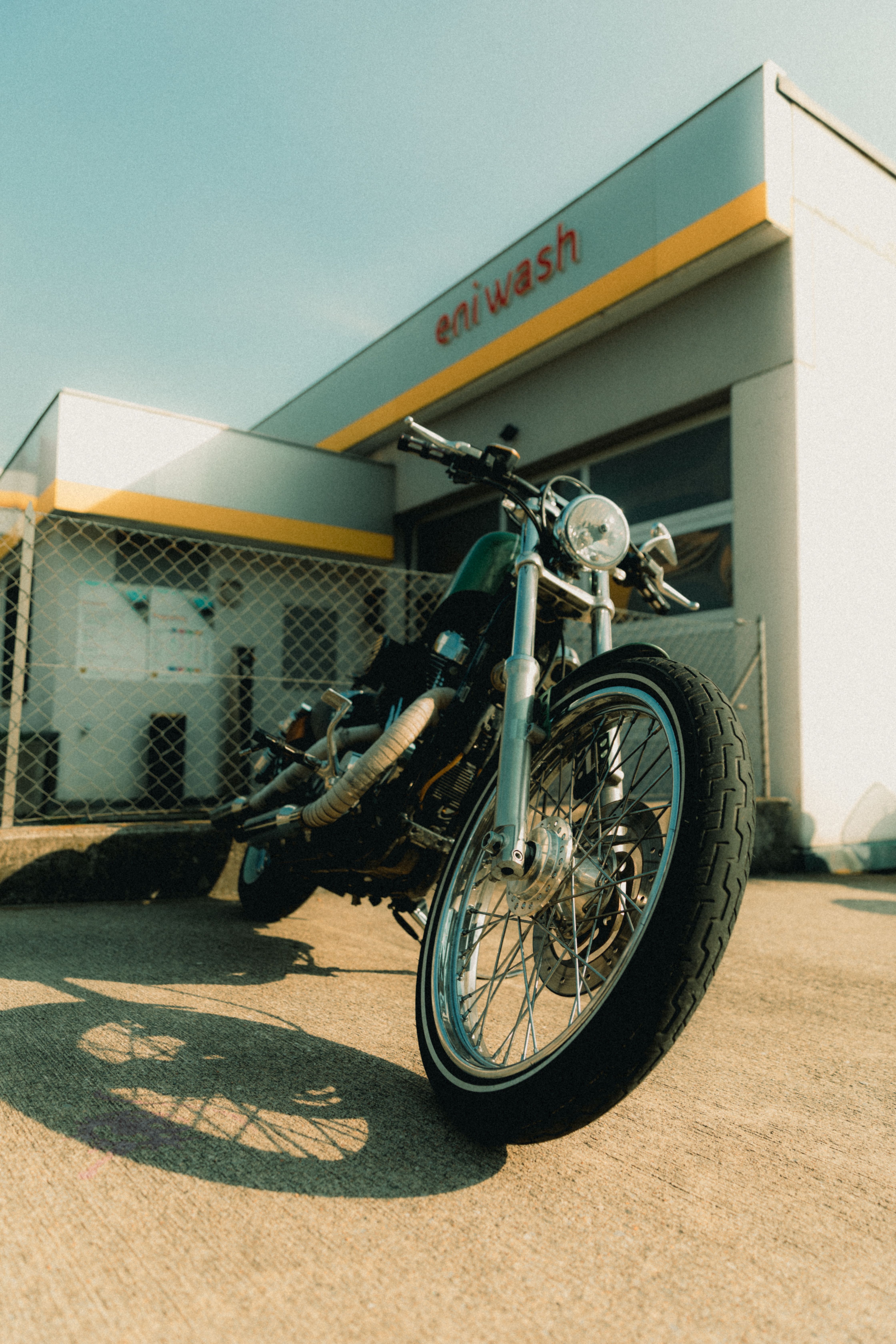 A Motorcycle Parked in front of a Building · Free Stock Photo