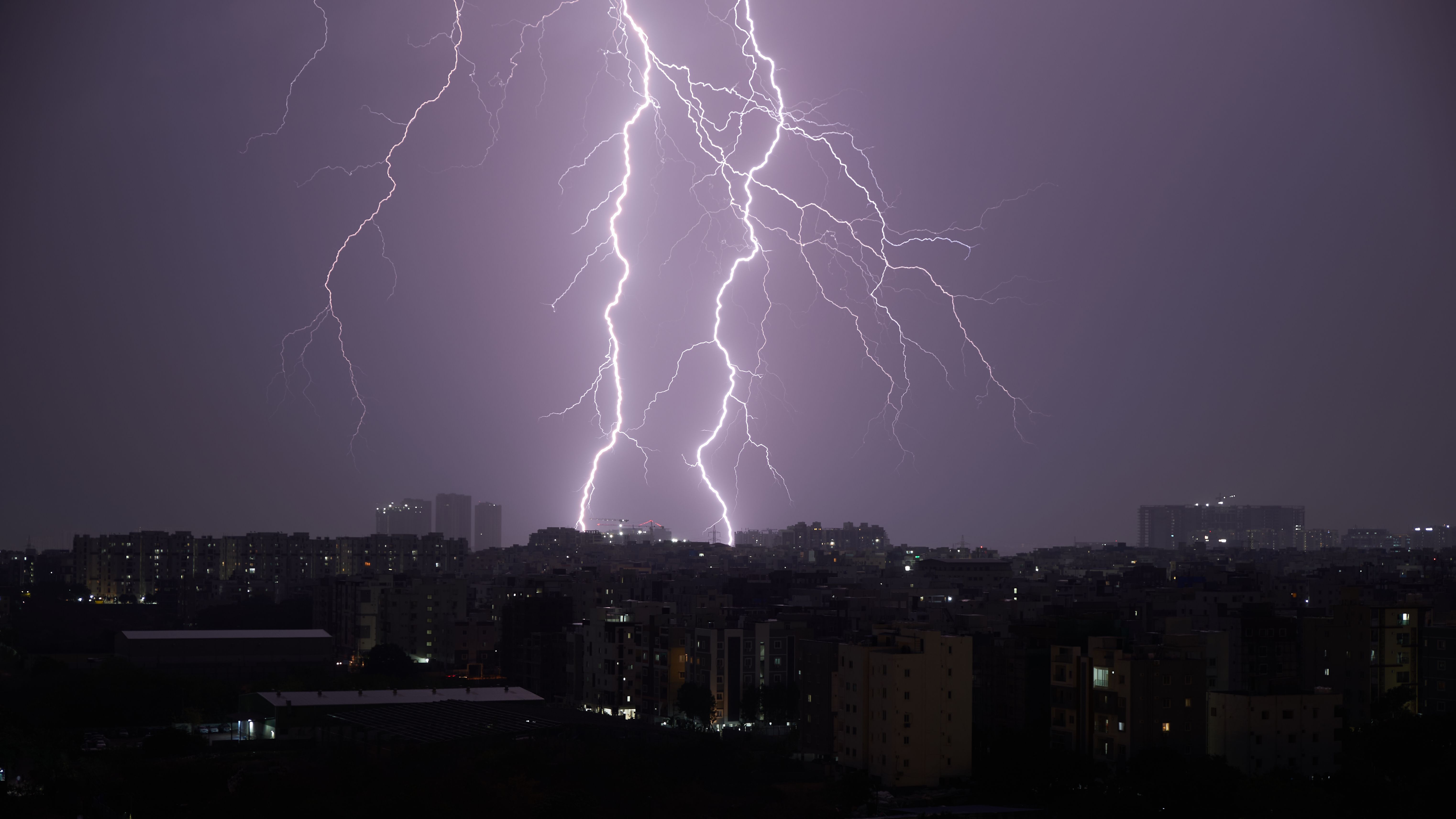View of Lightning Strikes above a City · Free Stock Photo