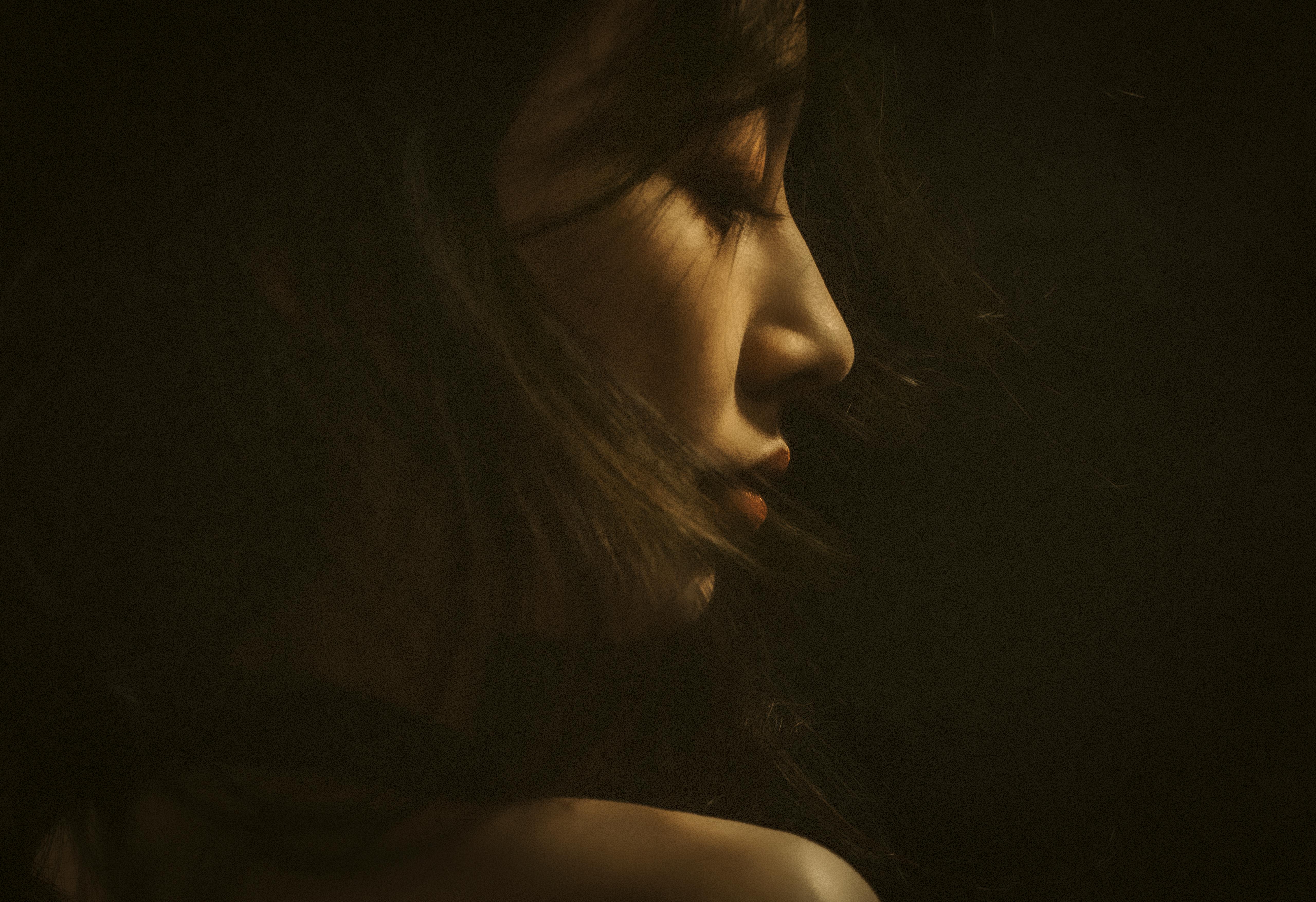 Light on Face of Woman with Eyes Closed · Free Stock Photo