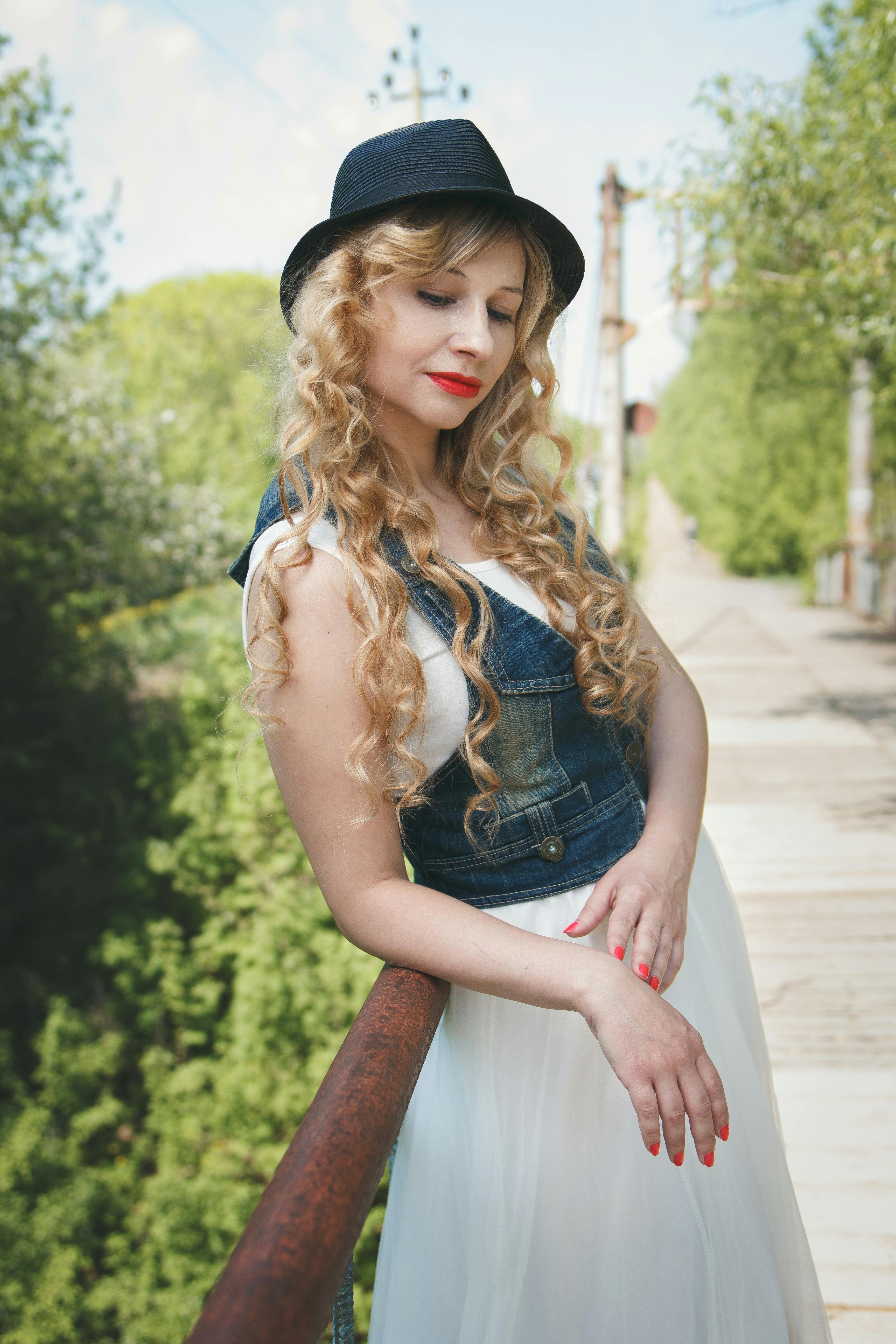 Woman in Floral dress posing for a photograph · Free Stock Photo
