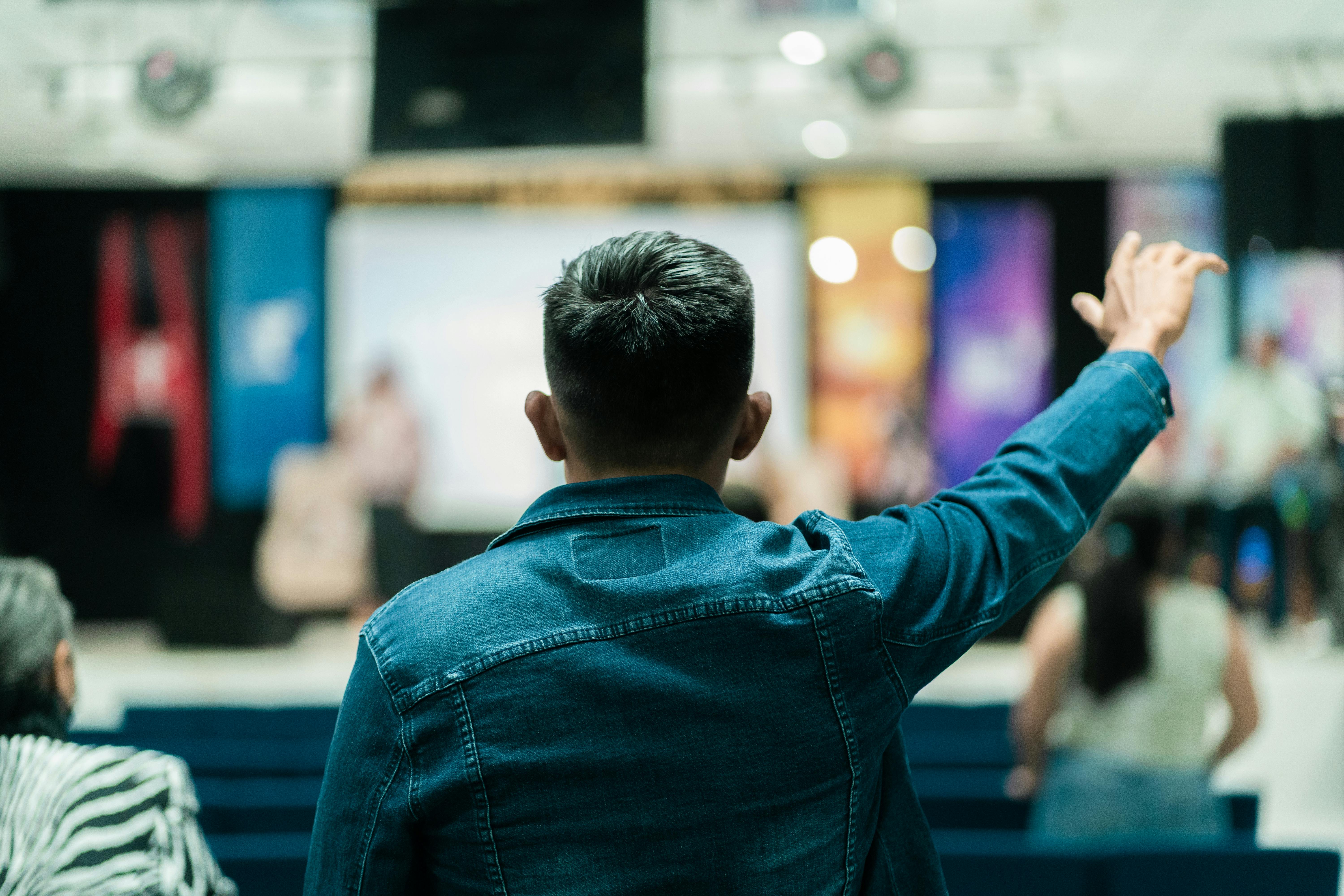 Audience Standing in an Auditorium during an Event · Free Stock Photo