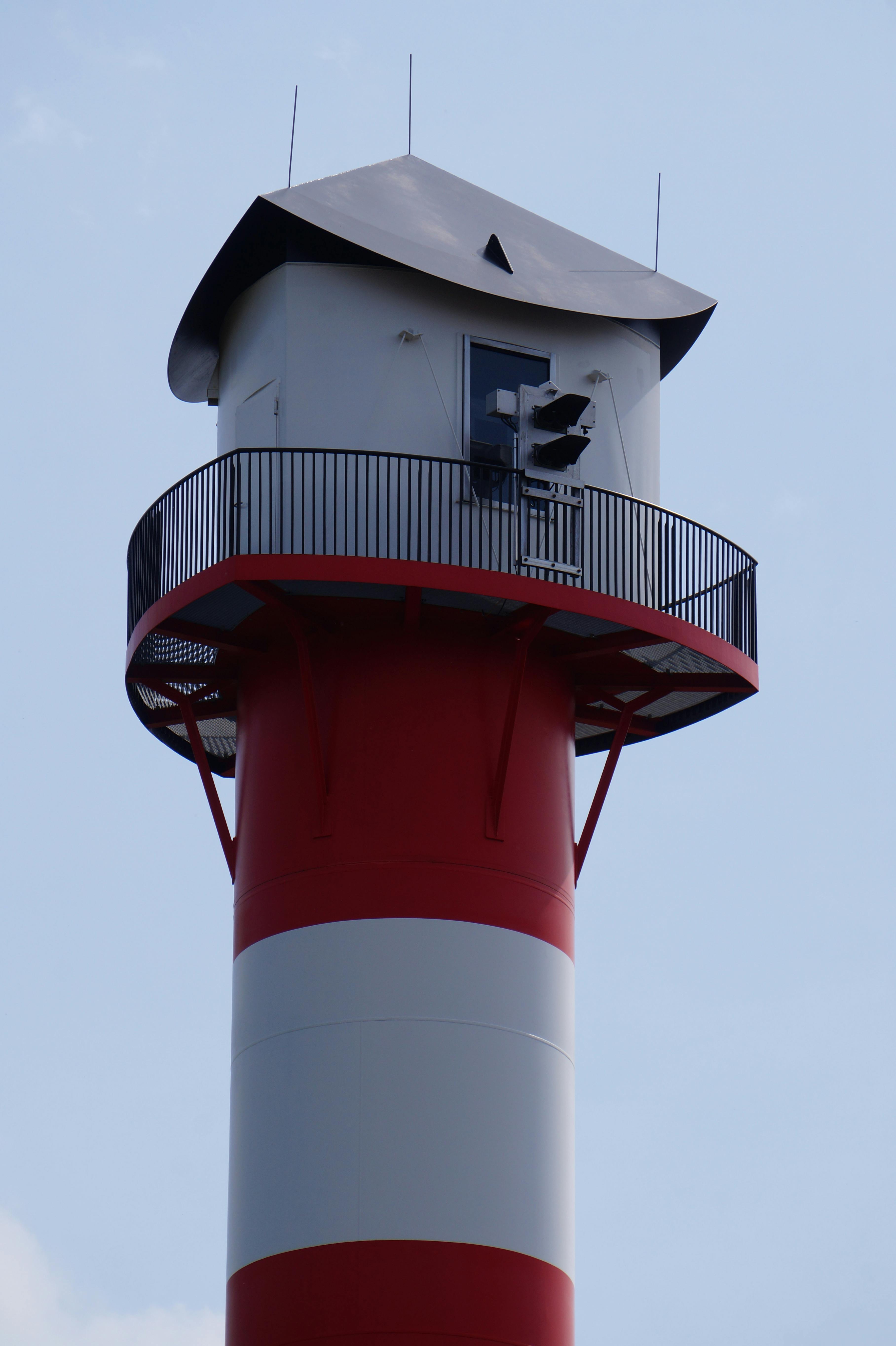 A Red and White Lighthouse with an Observation Deck · Free Stock Photo
