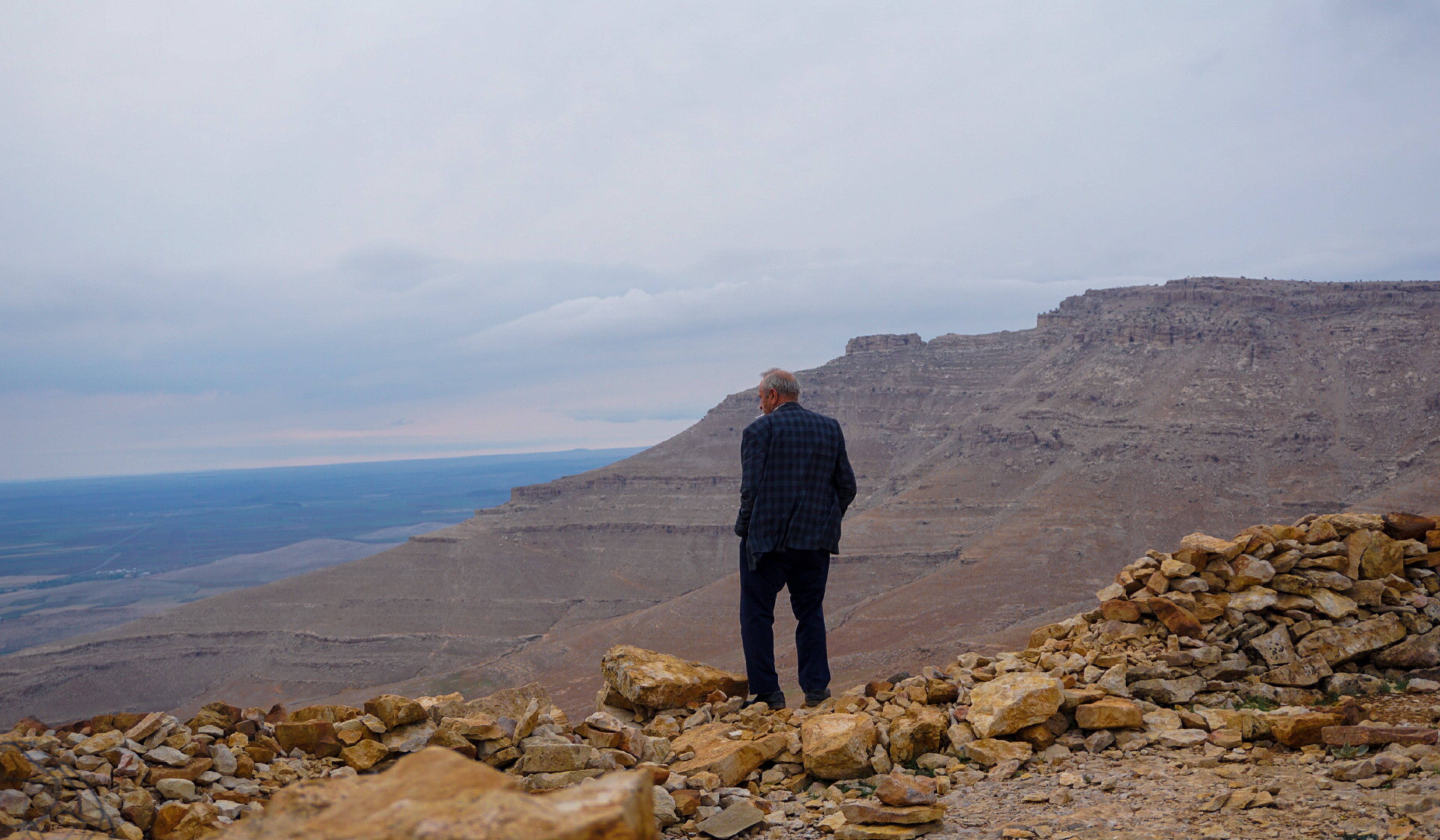 Man Standing at the Edge of a Cliff · Free Stock Photo