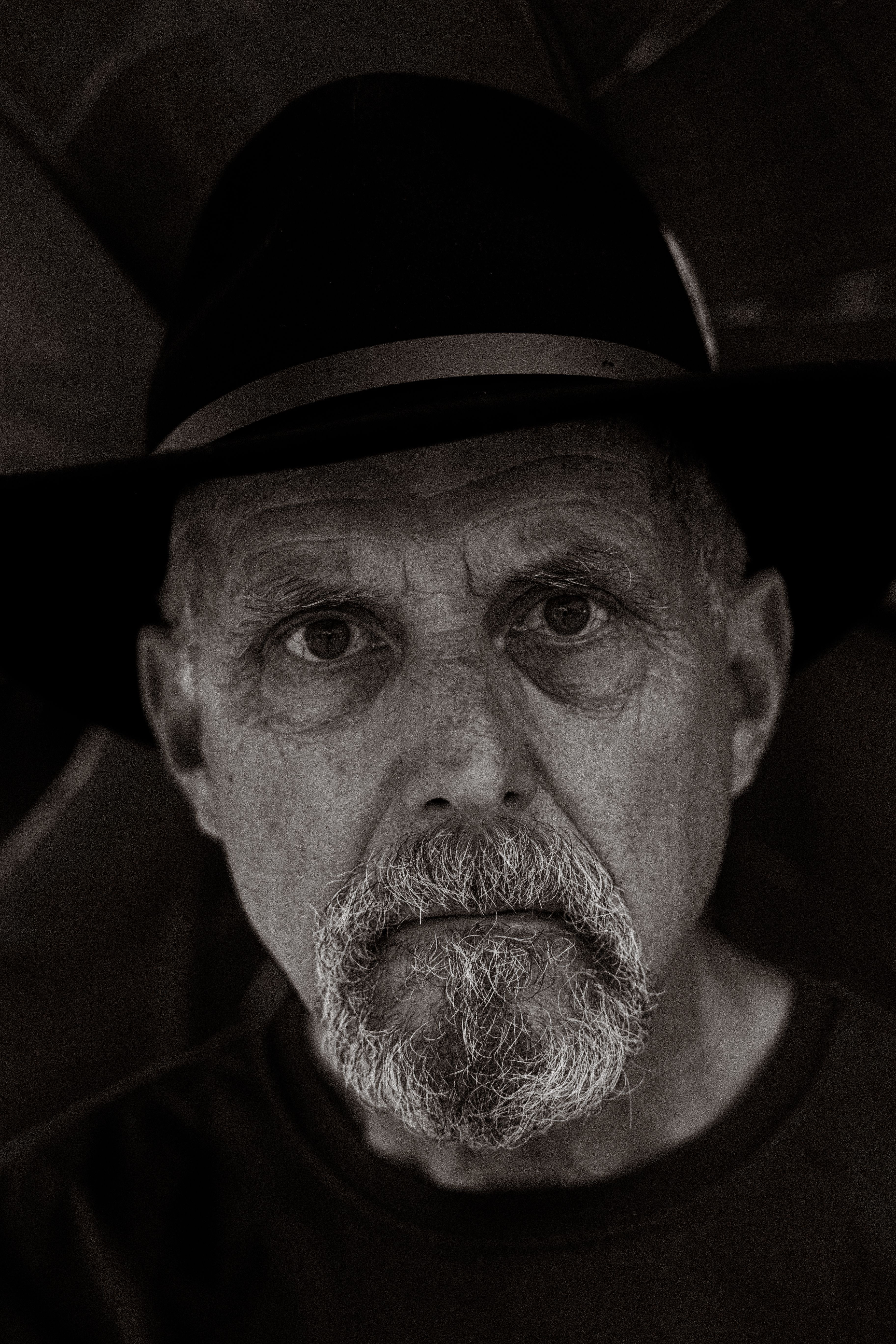 Elderly Man with Hat Holding String · Free Stock Photo