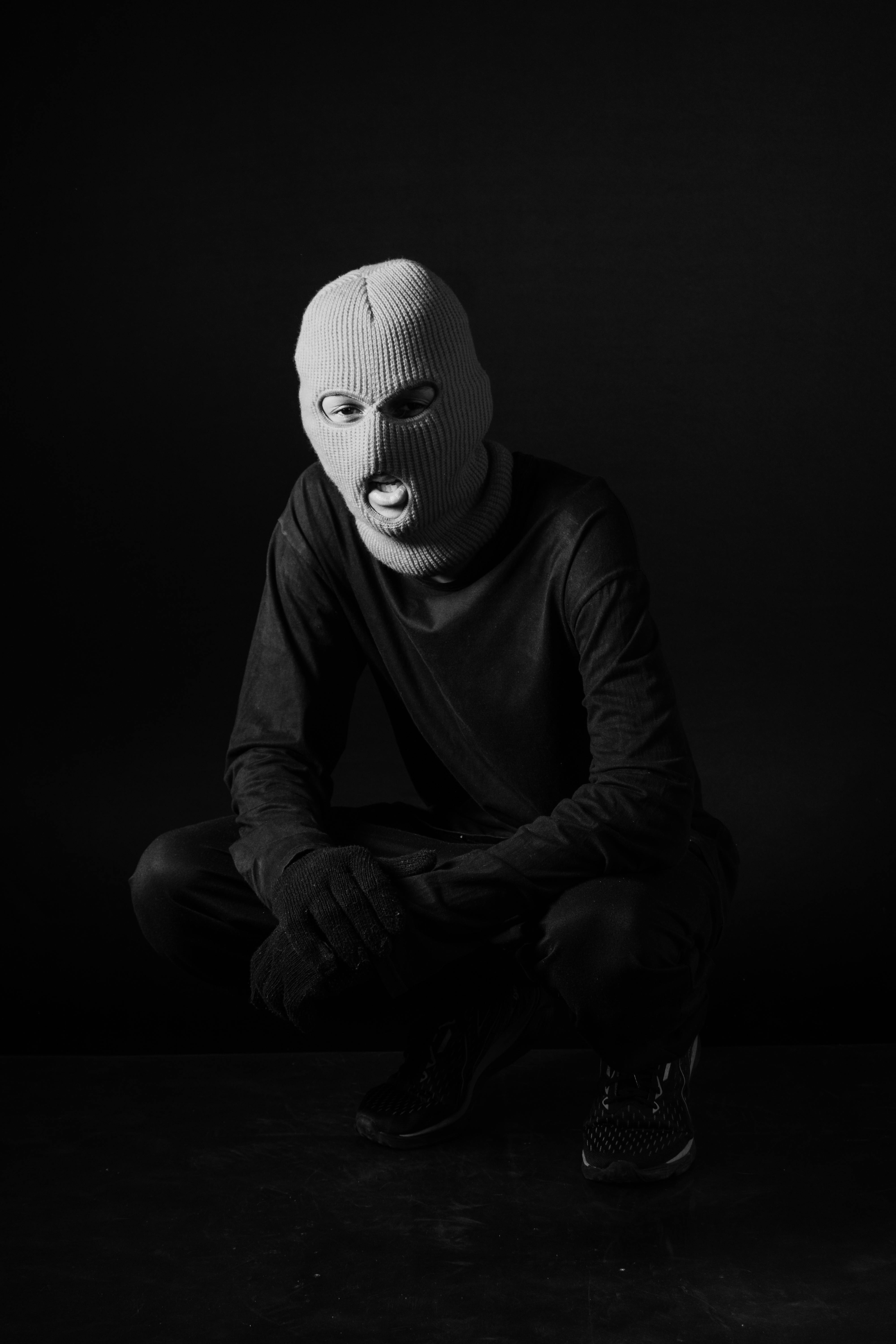 A Man Posing in Mask in Black and White · Free Stock Photo