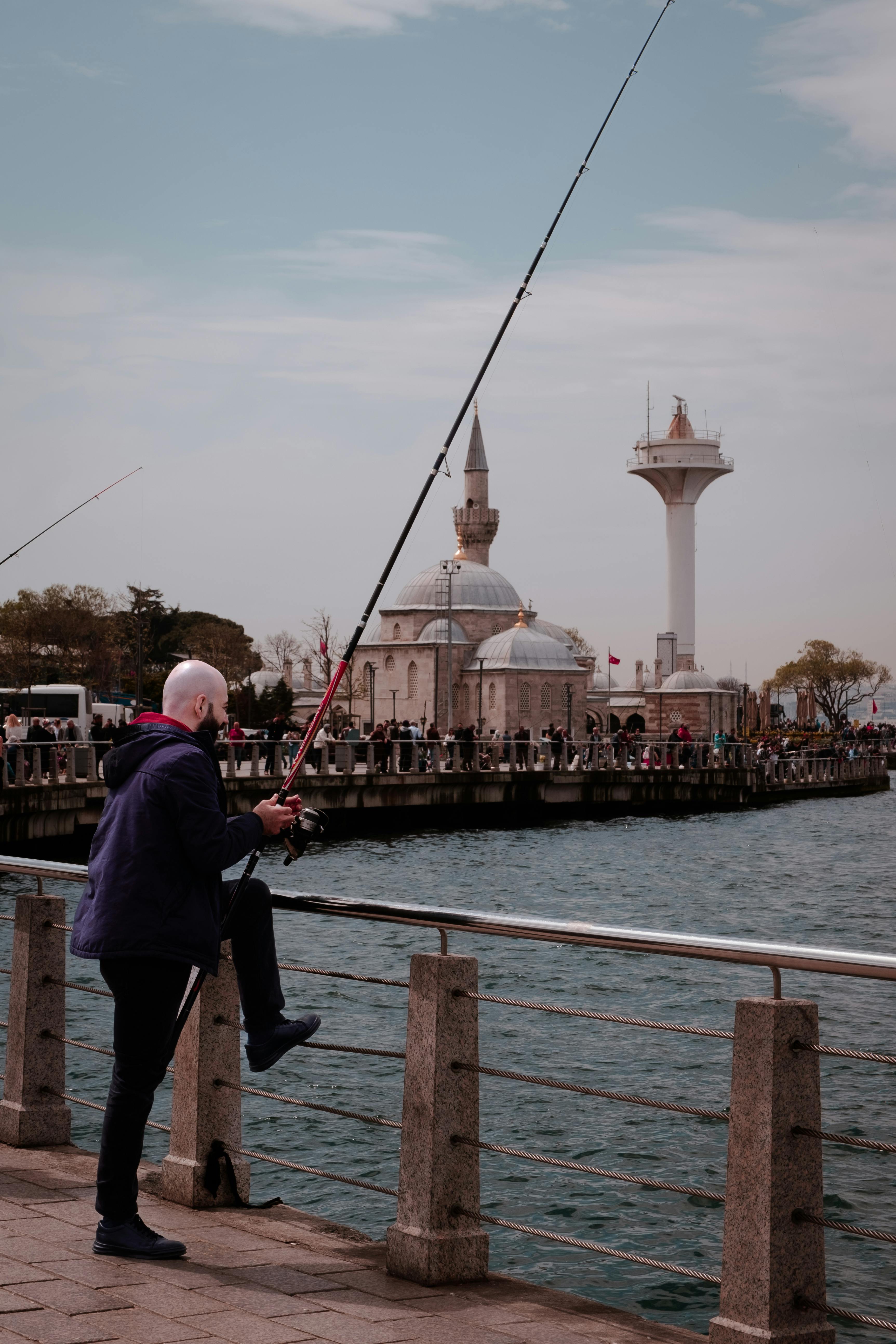 Angler Fishing from the Promenade Near Shemsi Ahmed Pasha Mosque in ...