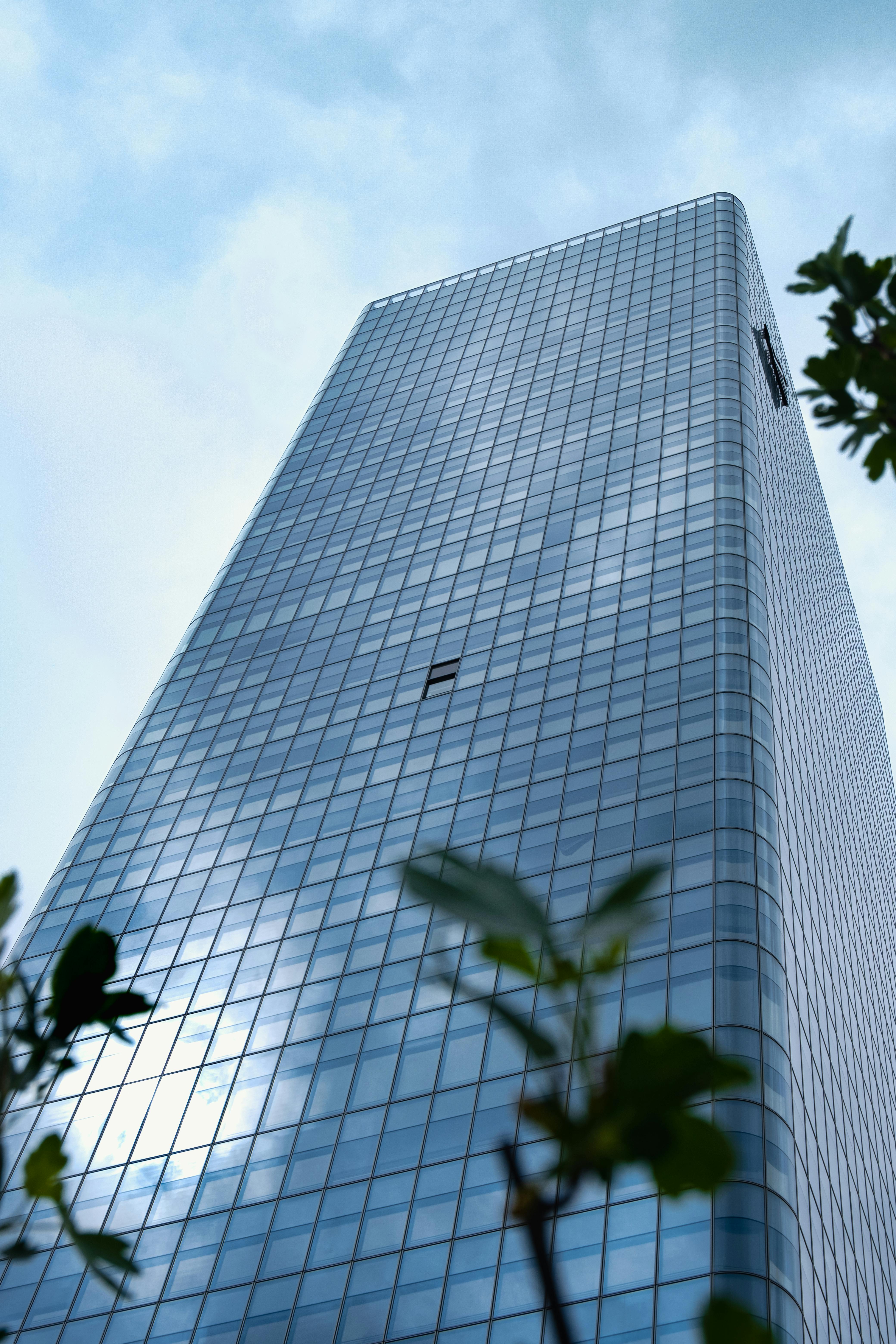 Low Angle Shot of a Modern Skyscraper in City · Free Stock Photo