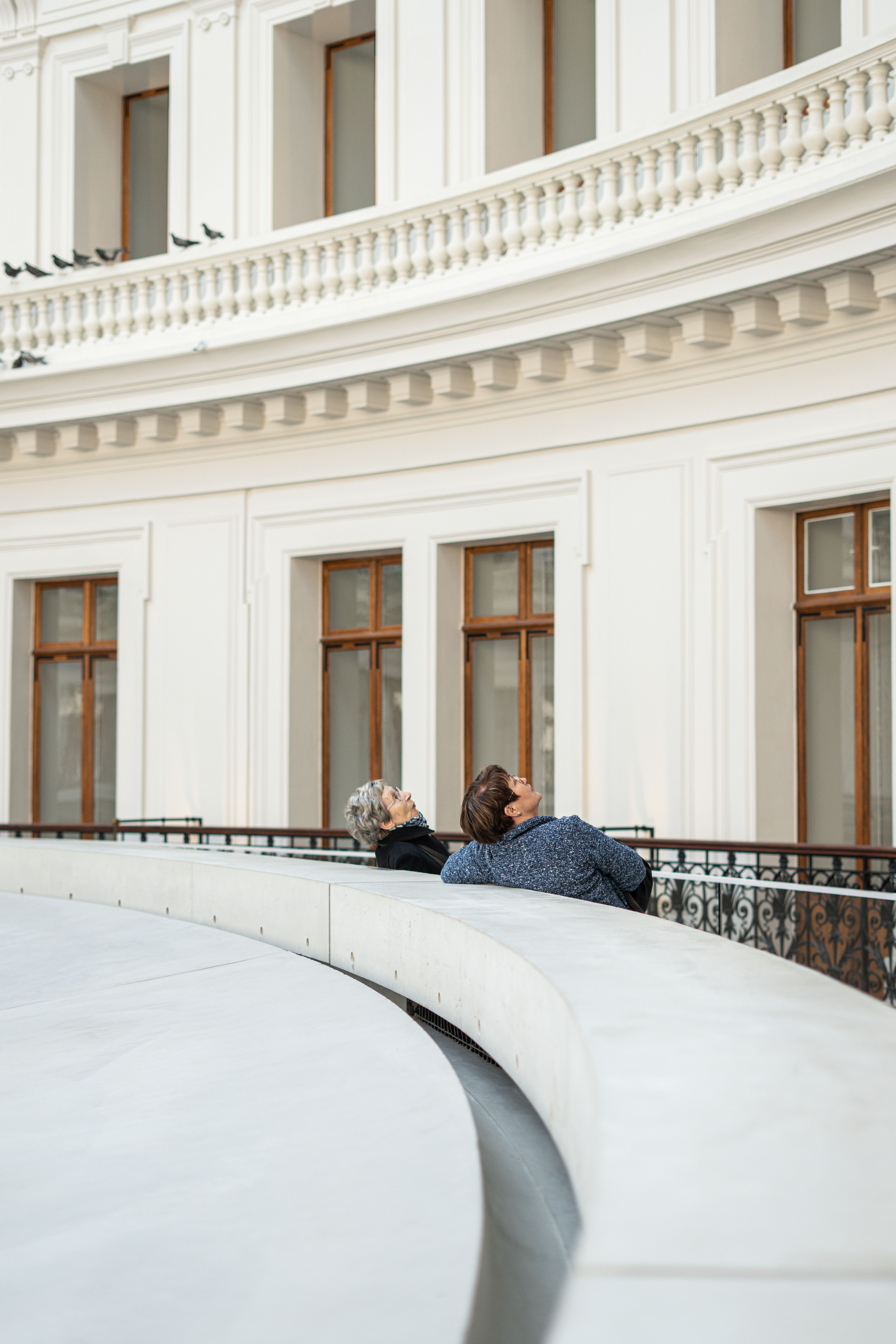 Photo of Two Women Looking Up · Free Stock Photo
