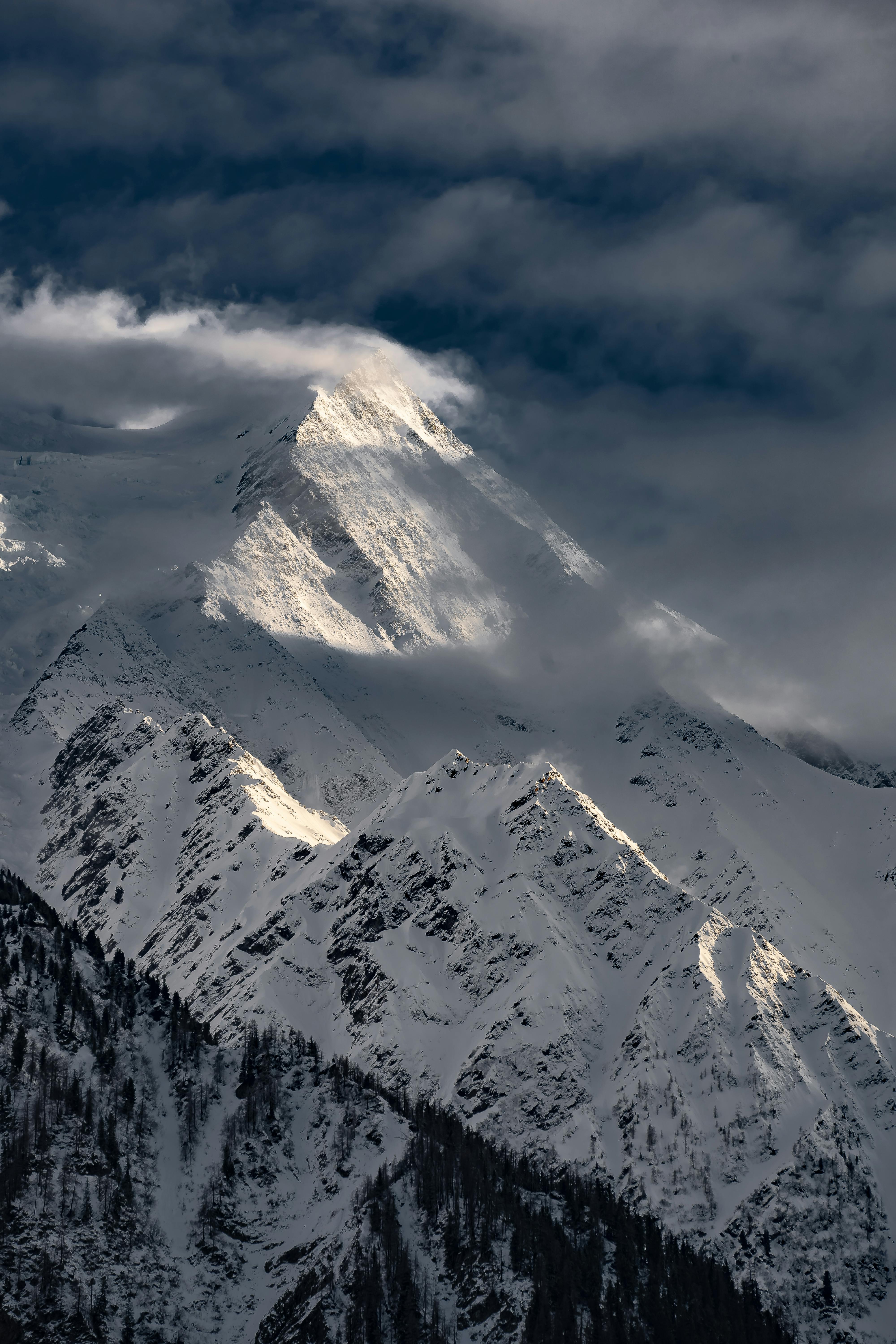 Snow Covered Mountain Hidden behind Clouds · Free Stock Photo