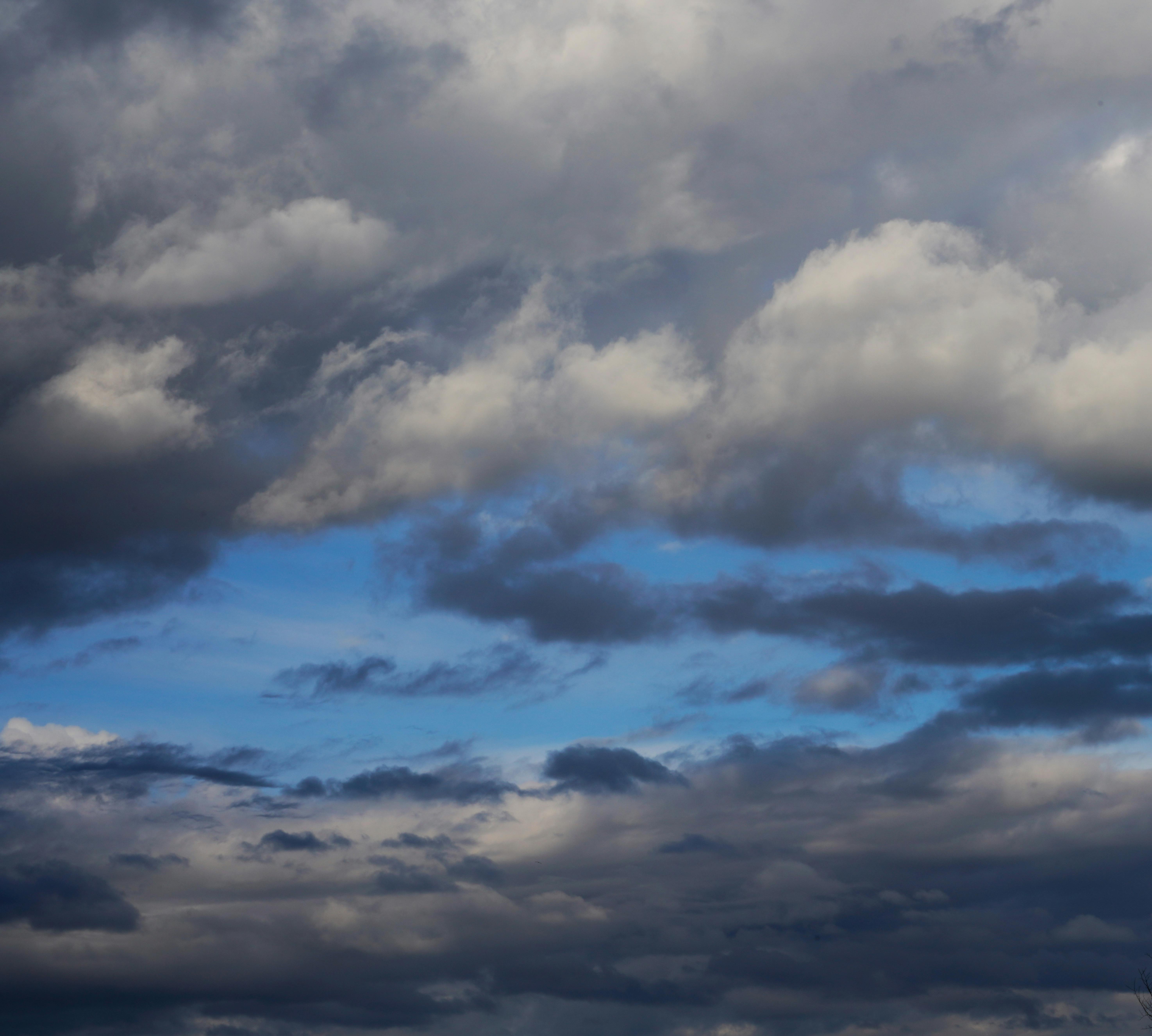 Stormy Grey Clouds in the Blue Sky · Free Stock Photo