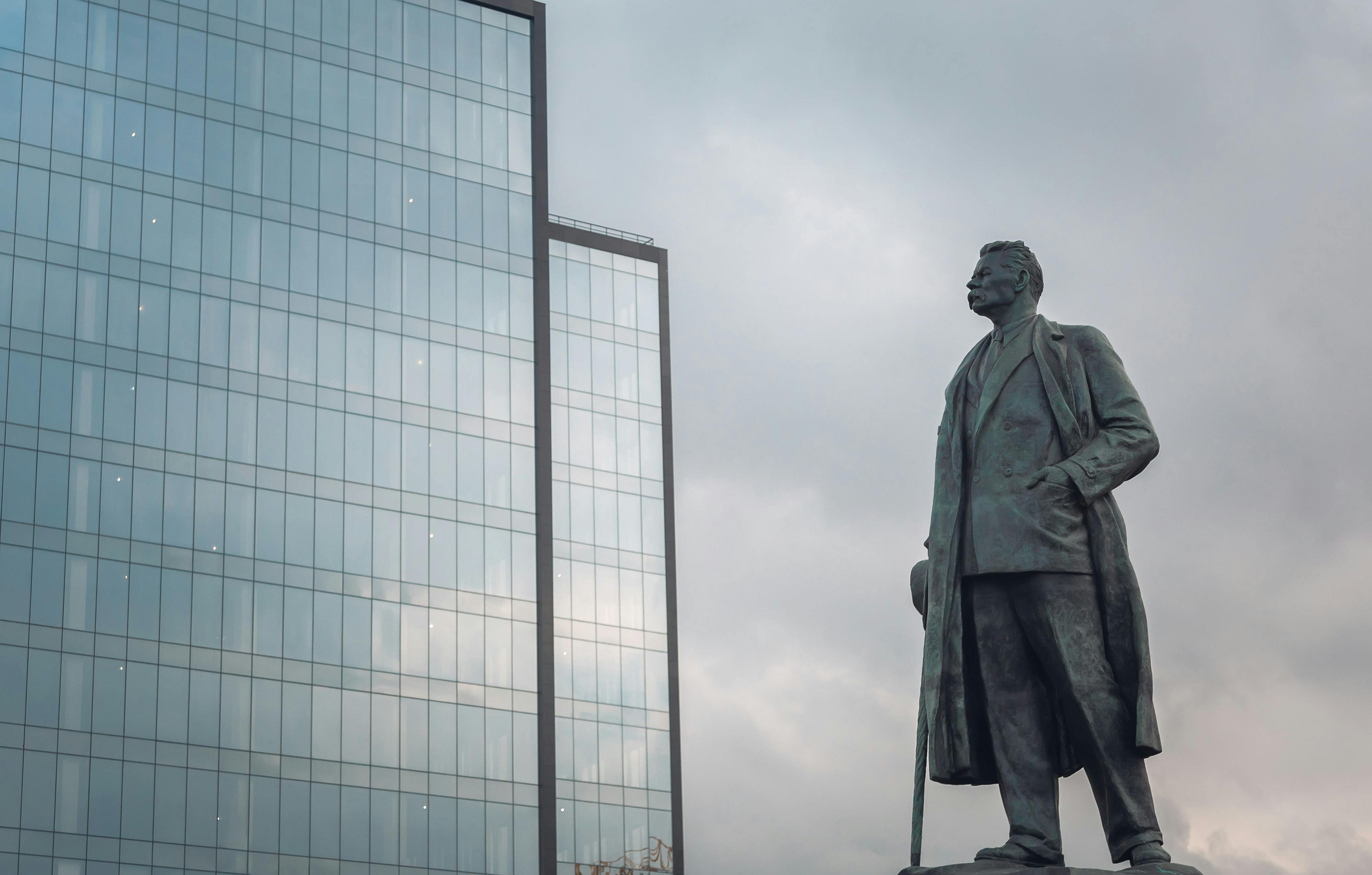 Maxim Gorky Monument by Office Buildings · Free Stock Photo