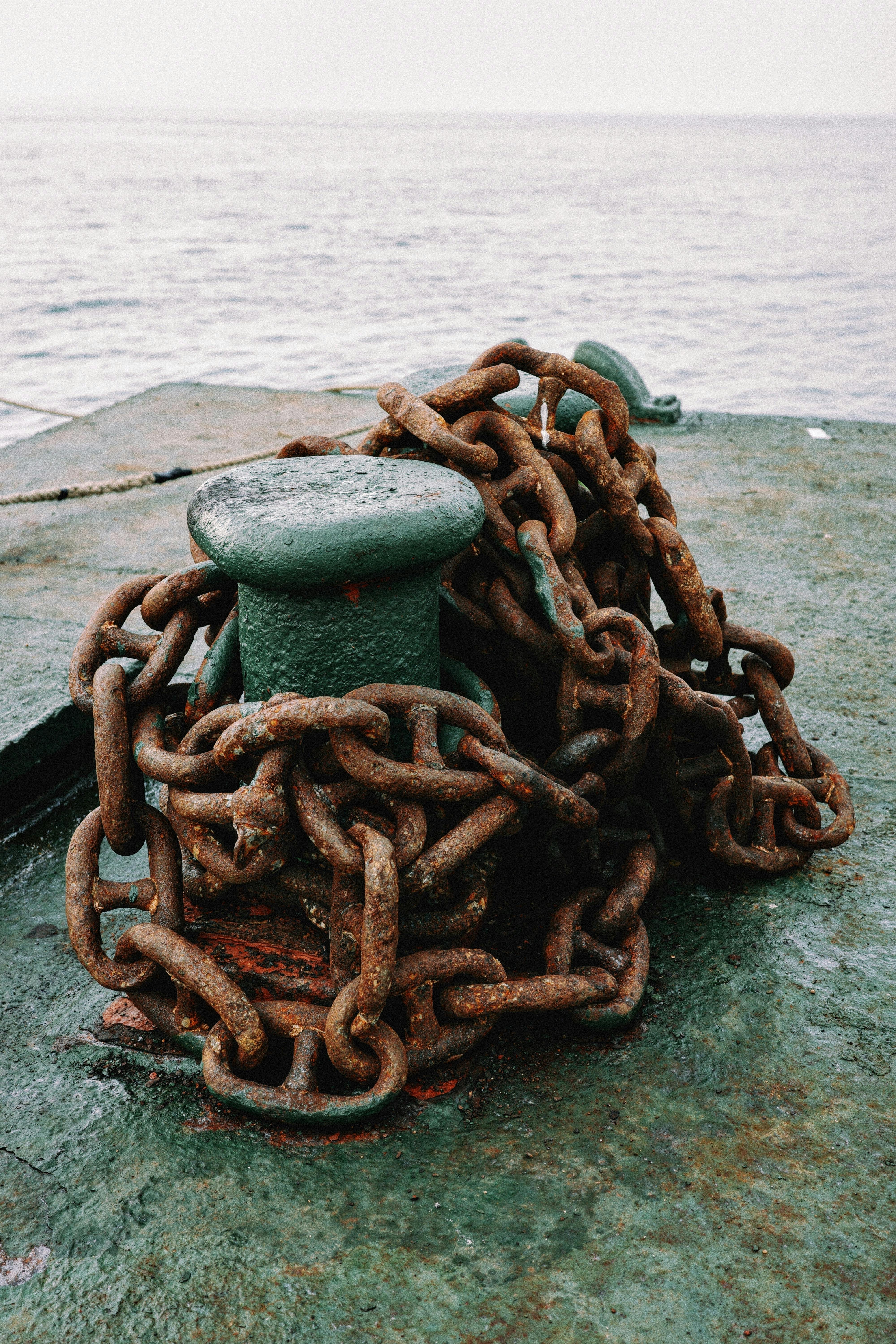 Rusty Chains around Post on Pier · Free Stock Photo