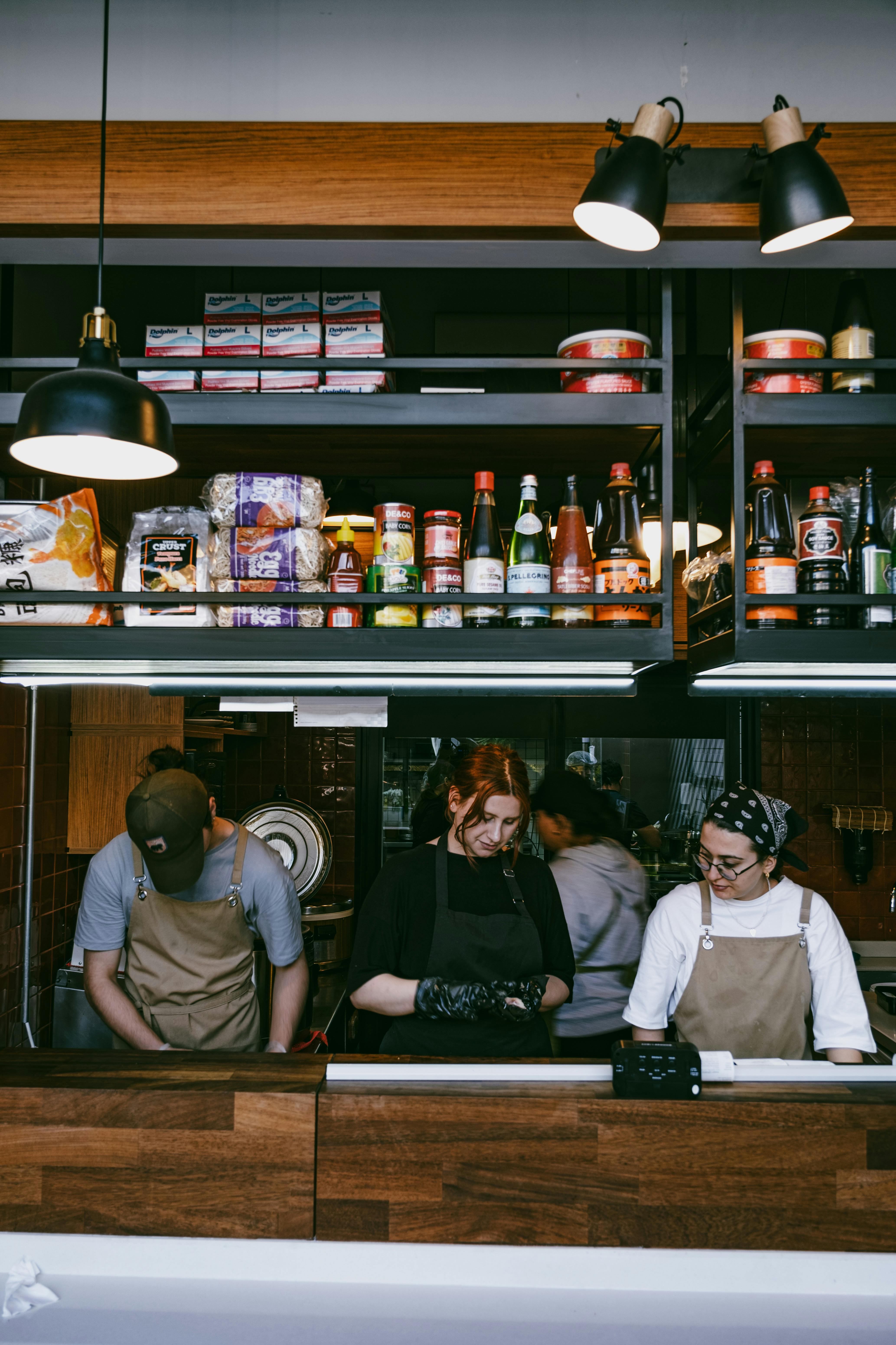 Smiling Barista Taking an Order · Free Stock Photo