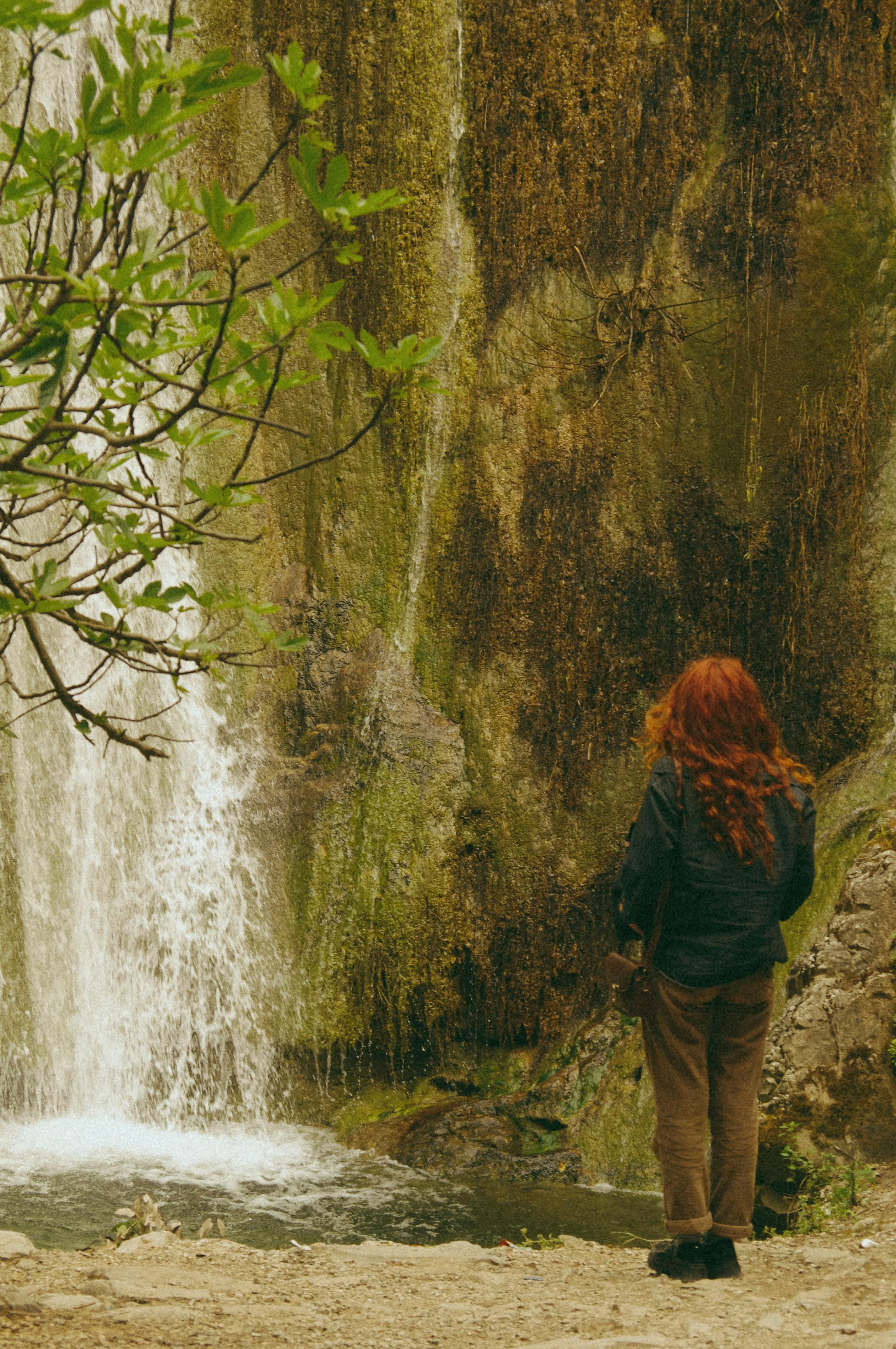 Woman Standing under Waterfall · Free Stock Photo
