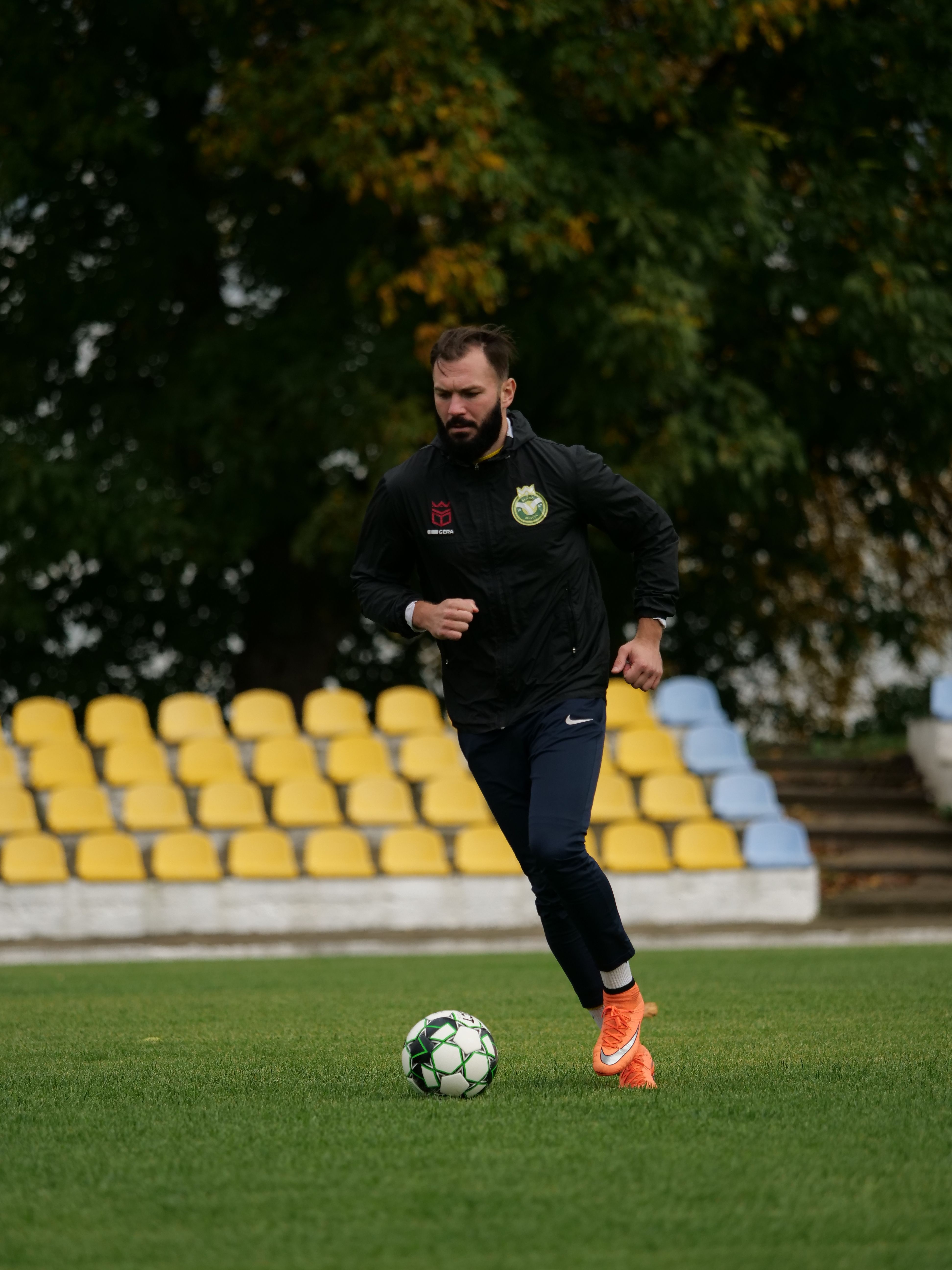 Man Running with Soccer Ball · Free Stock Photo