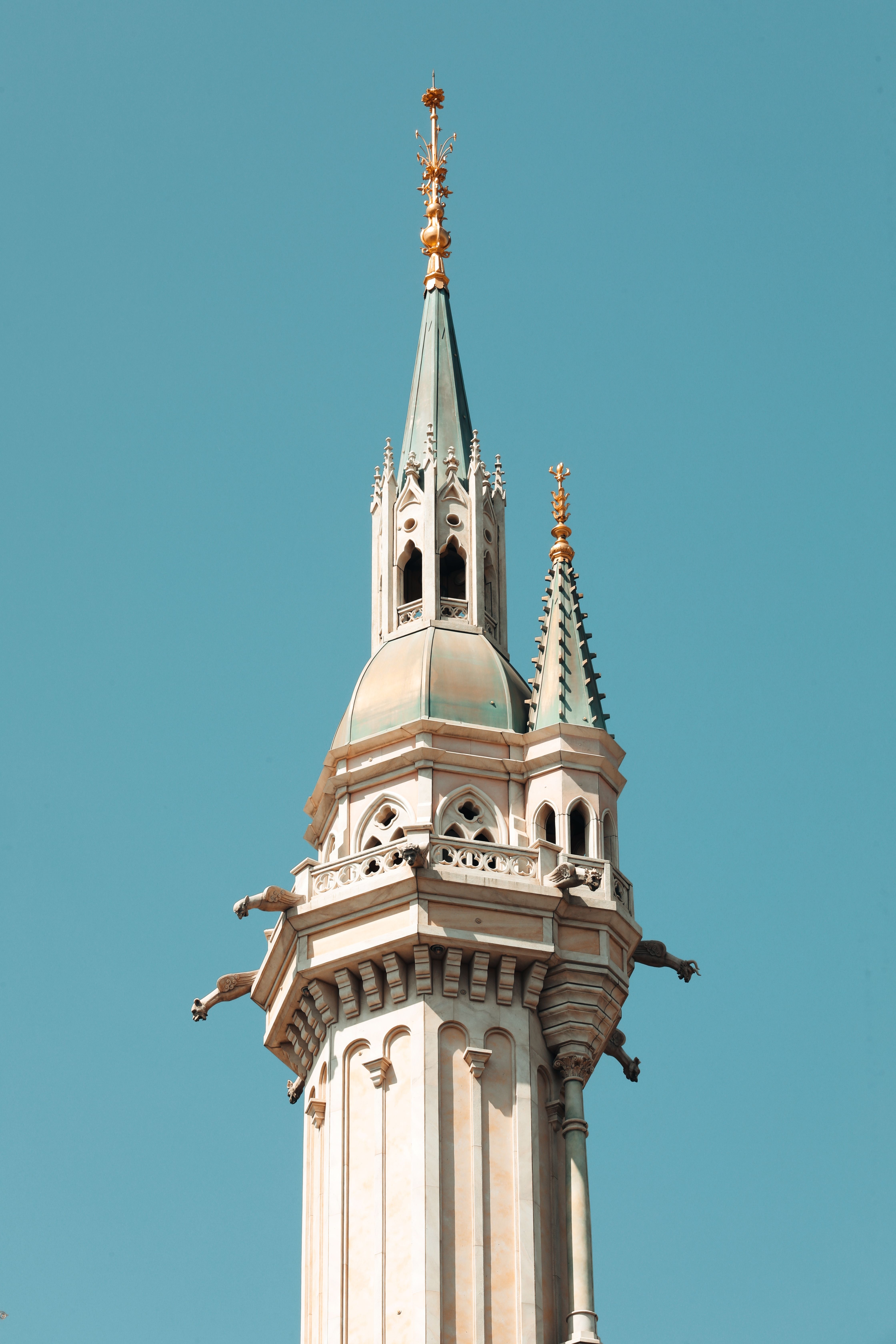 A tall spire with a clock on it · Free Stock Photo