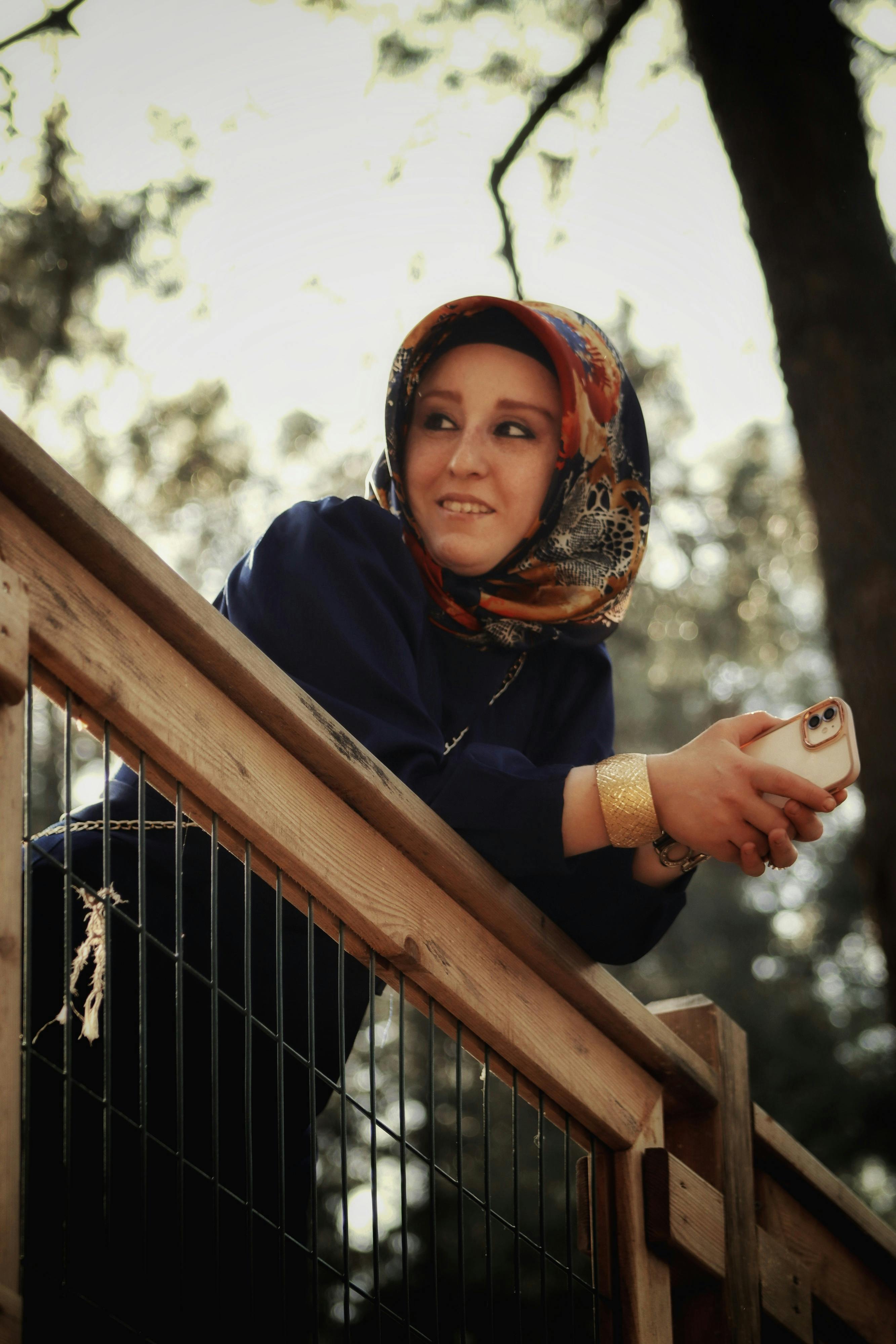 Beautiful Woman Leaning on Railing · Free Stock Photo