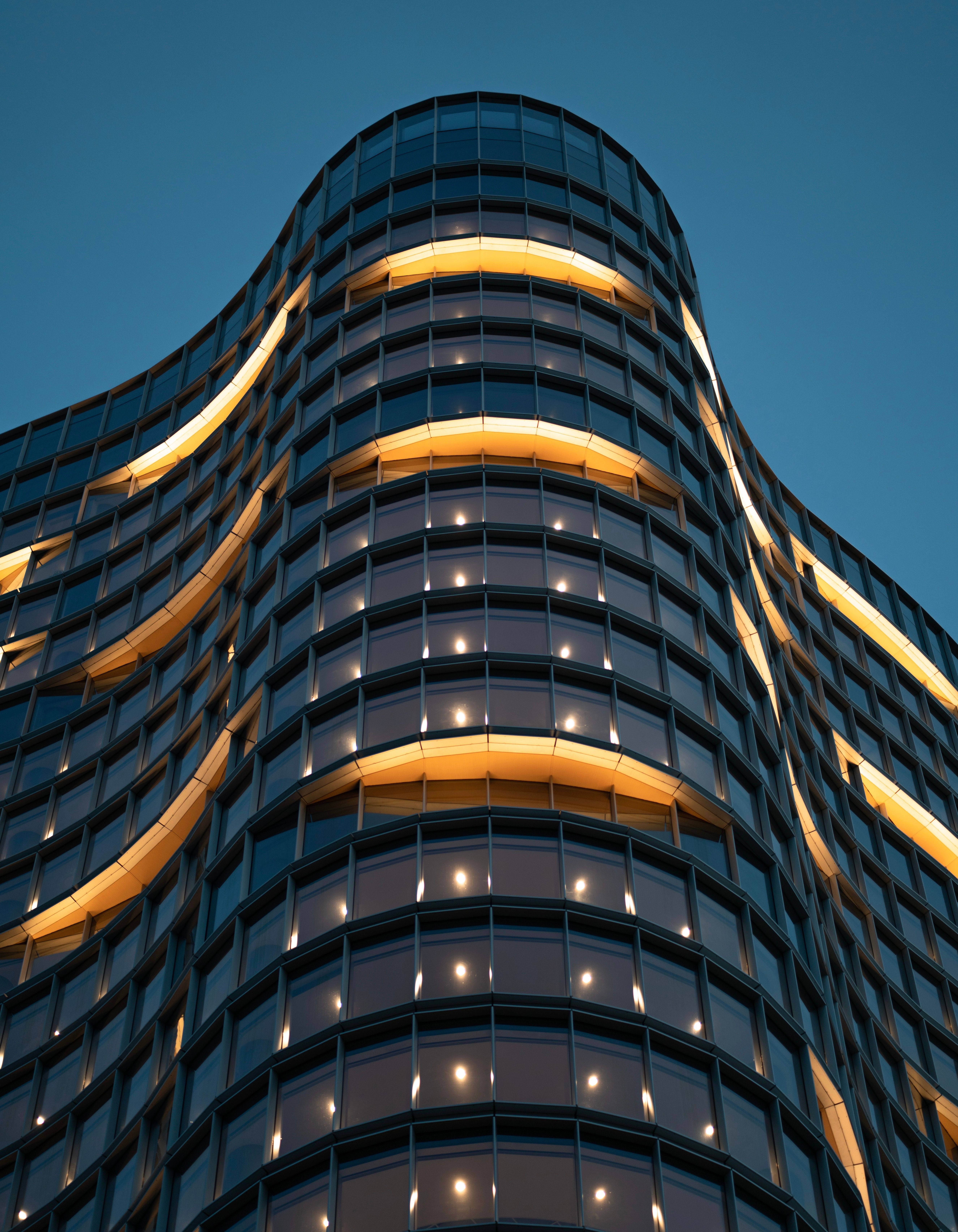 Illuminated Glass Skyscraper at Night · Free Stock Photo