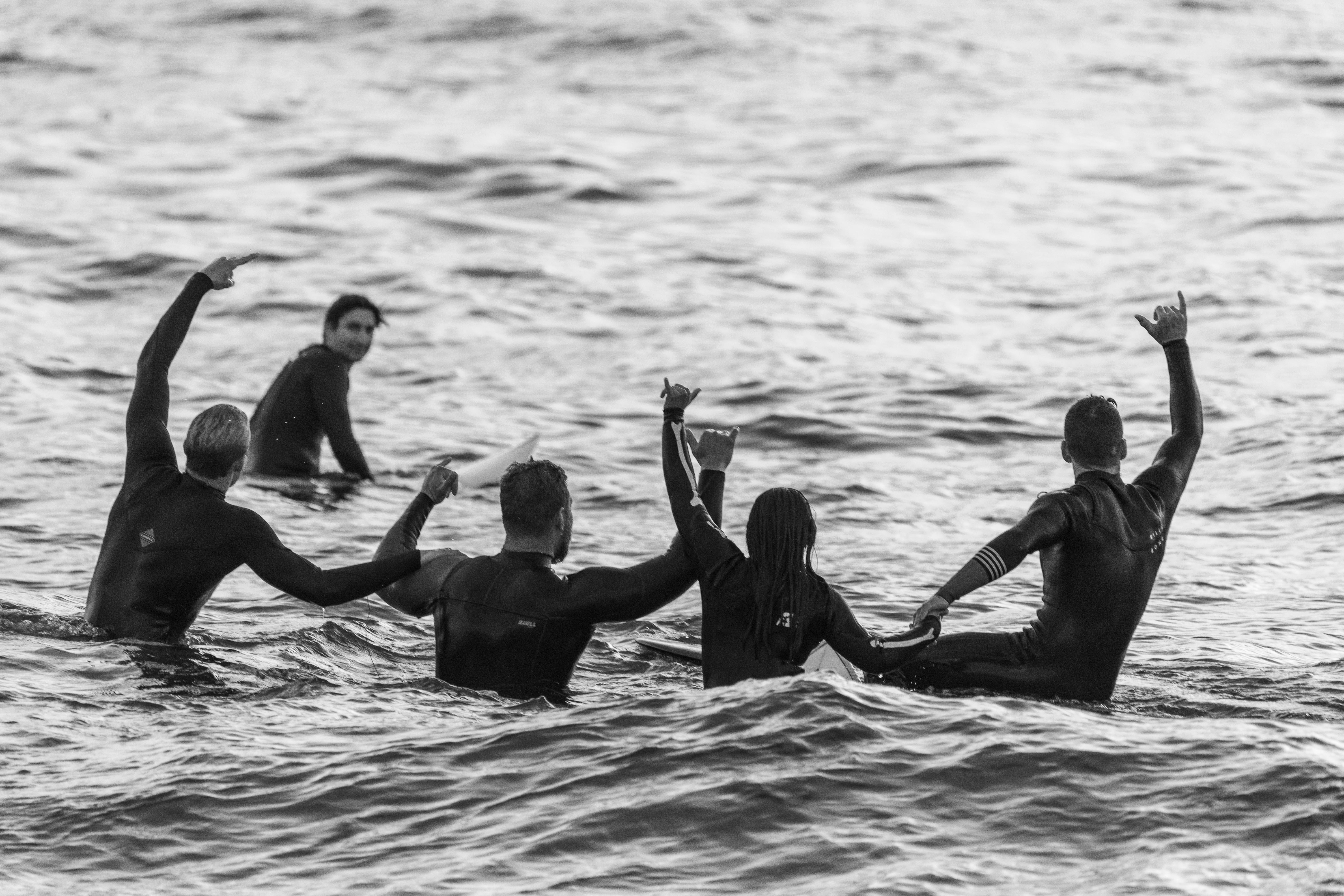 Five Surfers Having Fun on the Sea · Free Stock Photo