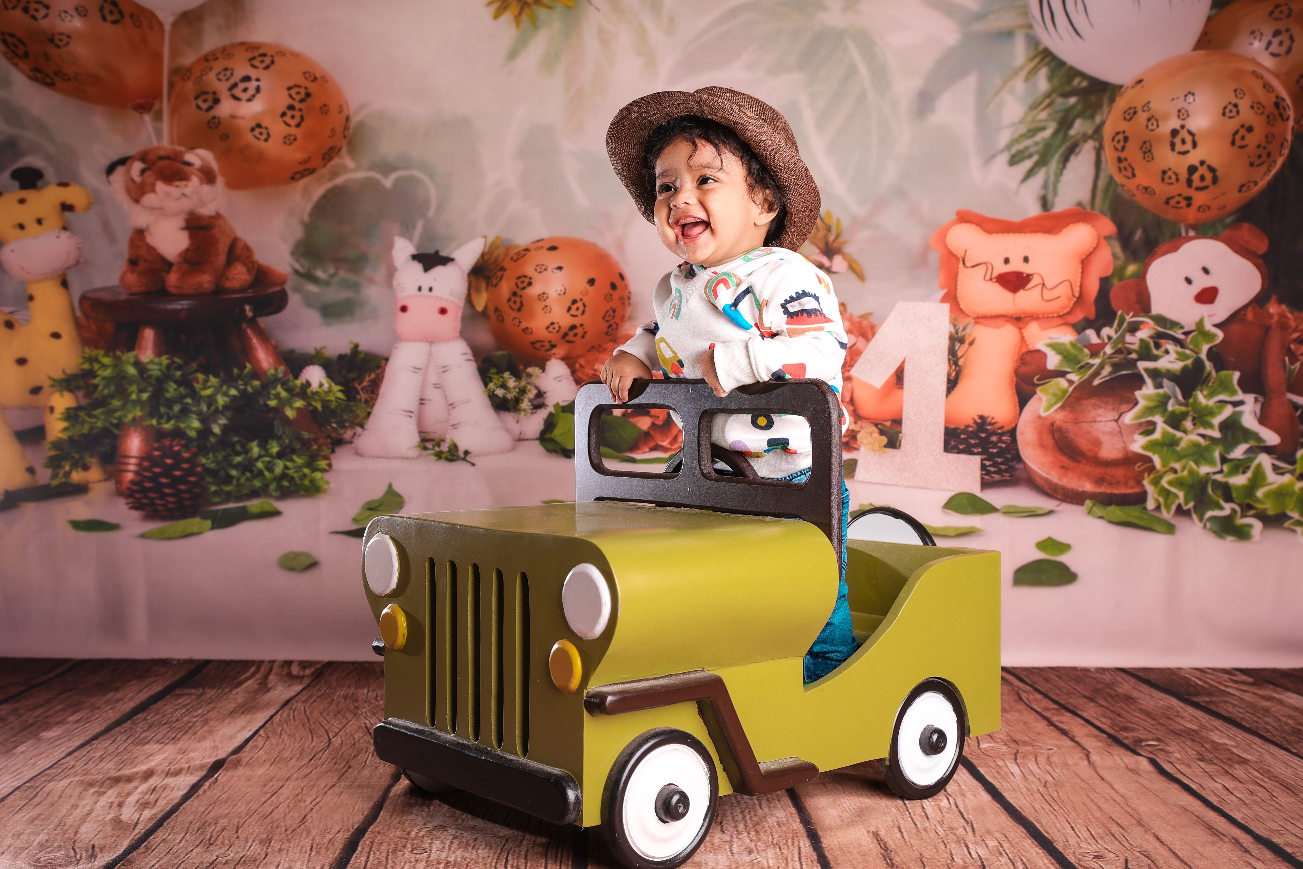 A Little Boy Riding a Toy Car · Free Stock Photo