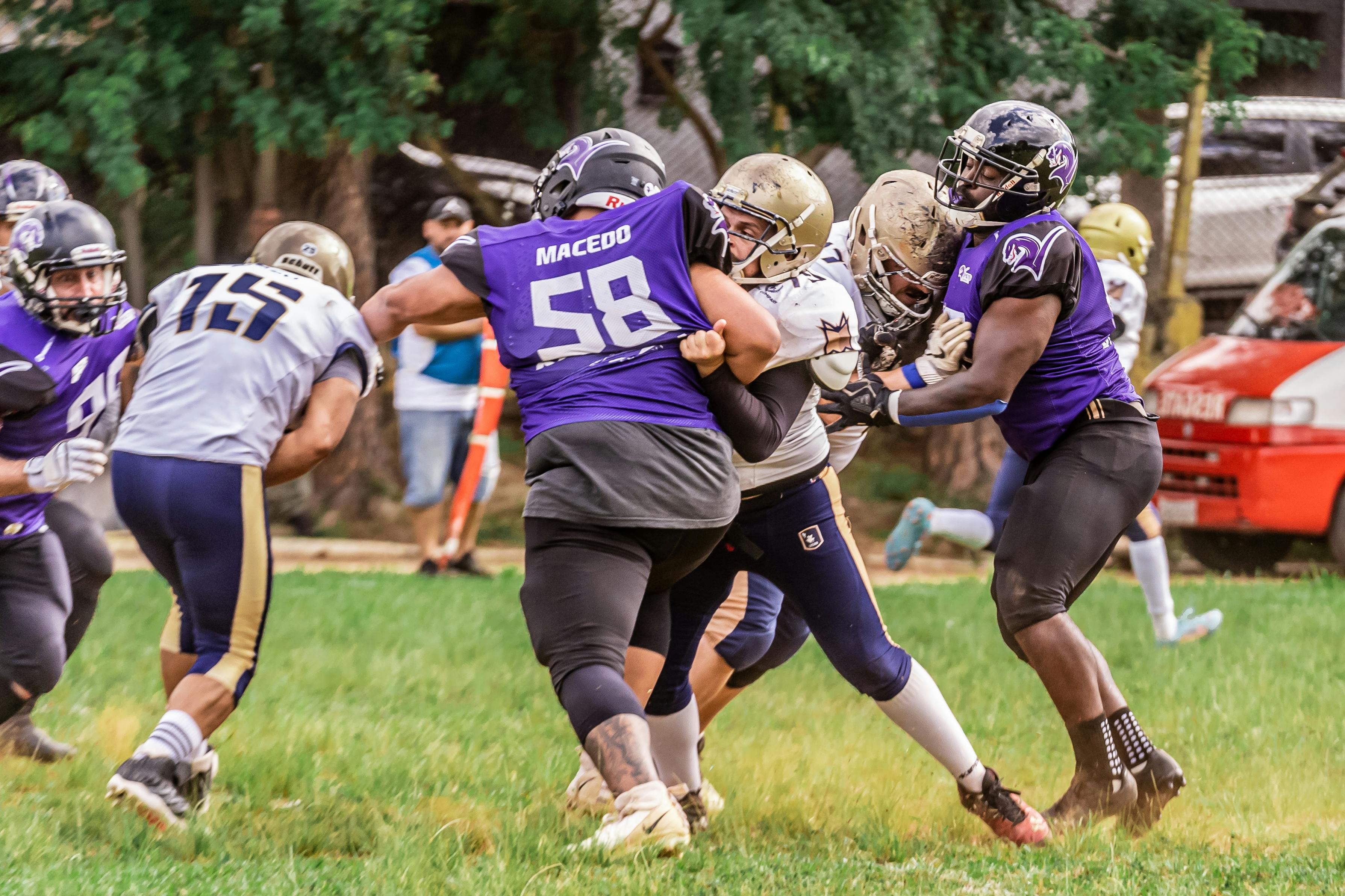 Men Running Playing Football during Daytime · Free Stock Photo