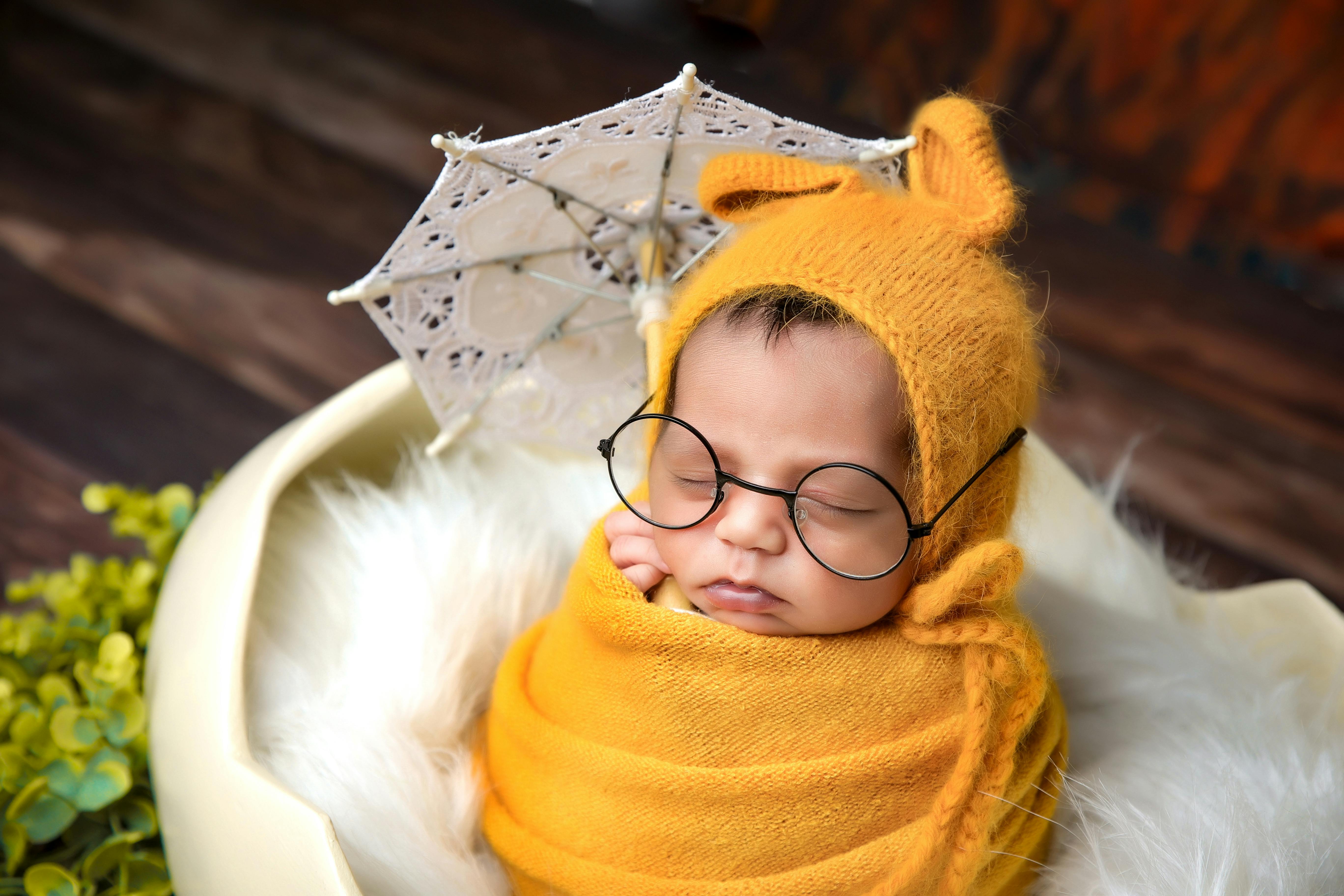 Newborn Baby Photoshoot in a Basket with Flowers · Free Stock Photo