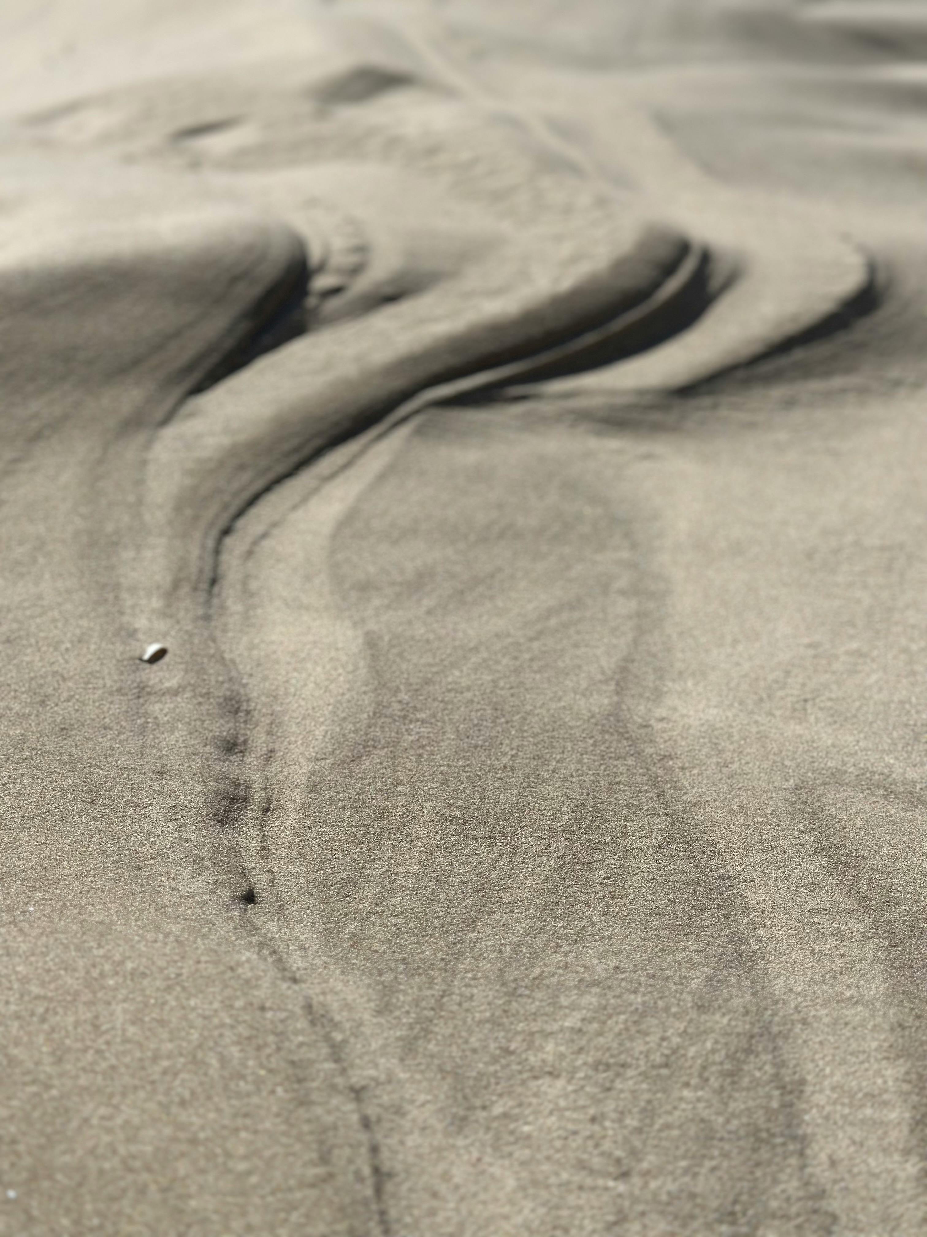 Black and White Close-up of the Sand on a Beach · Free Stock Photo