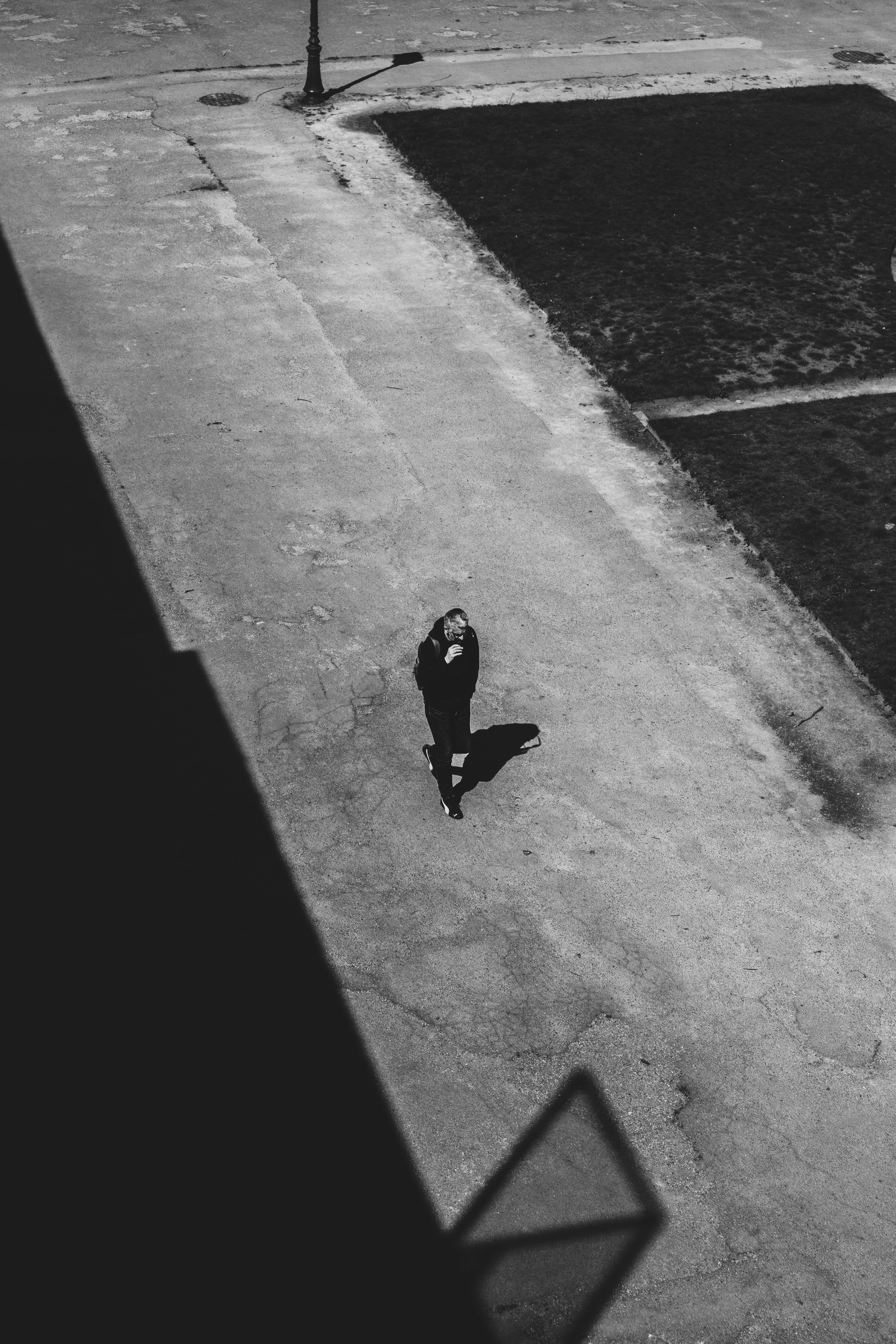 Man Walking on Empty Road · Free Stock Photo