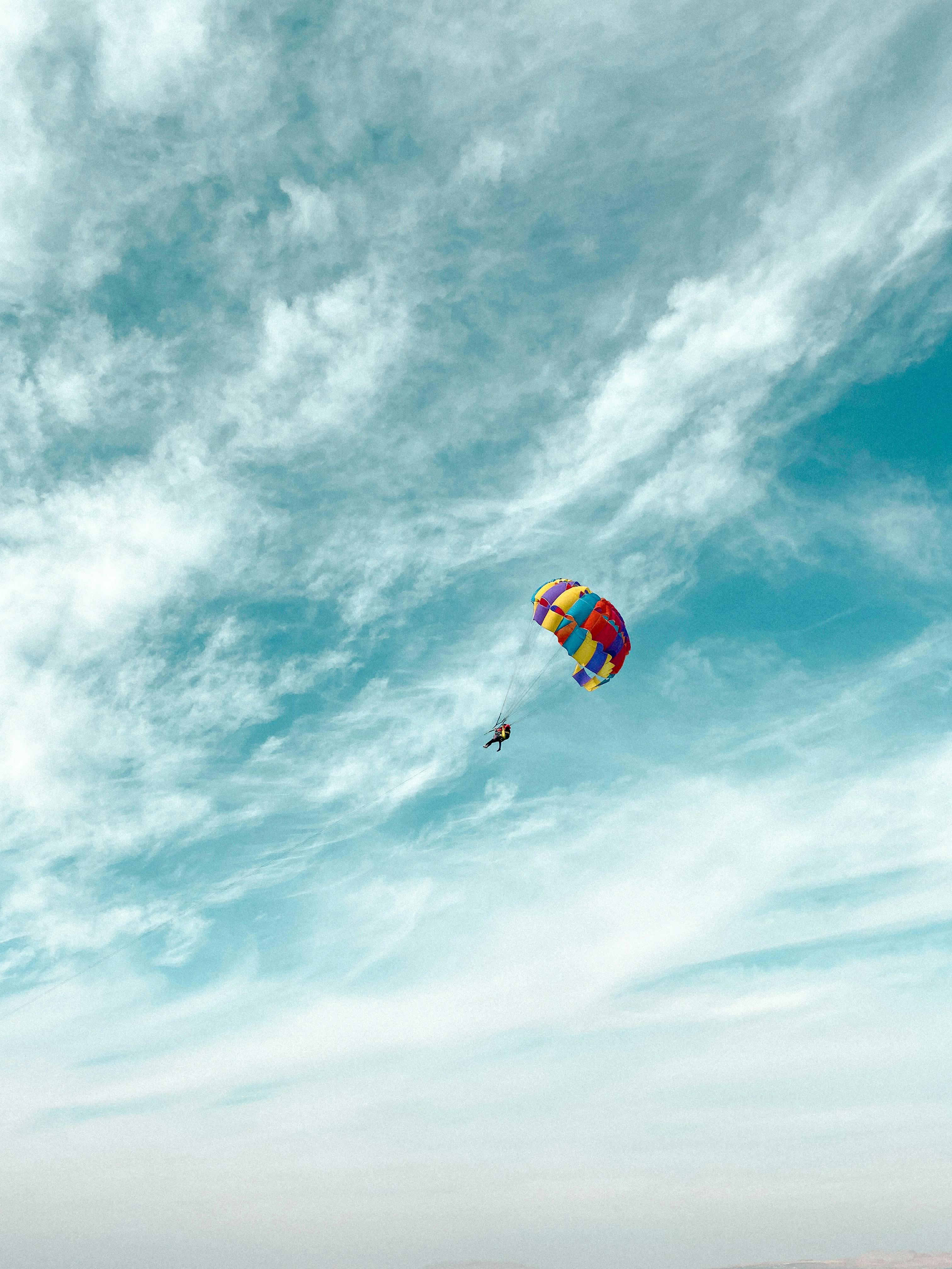 Person Riding on Parachute · Free Stock Photo