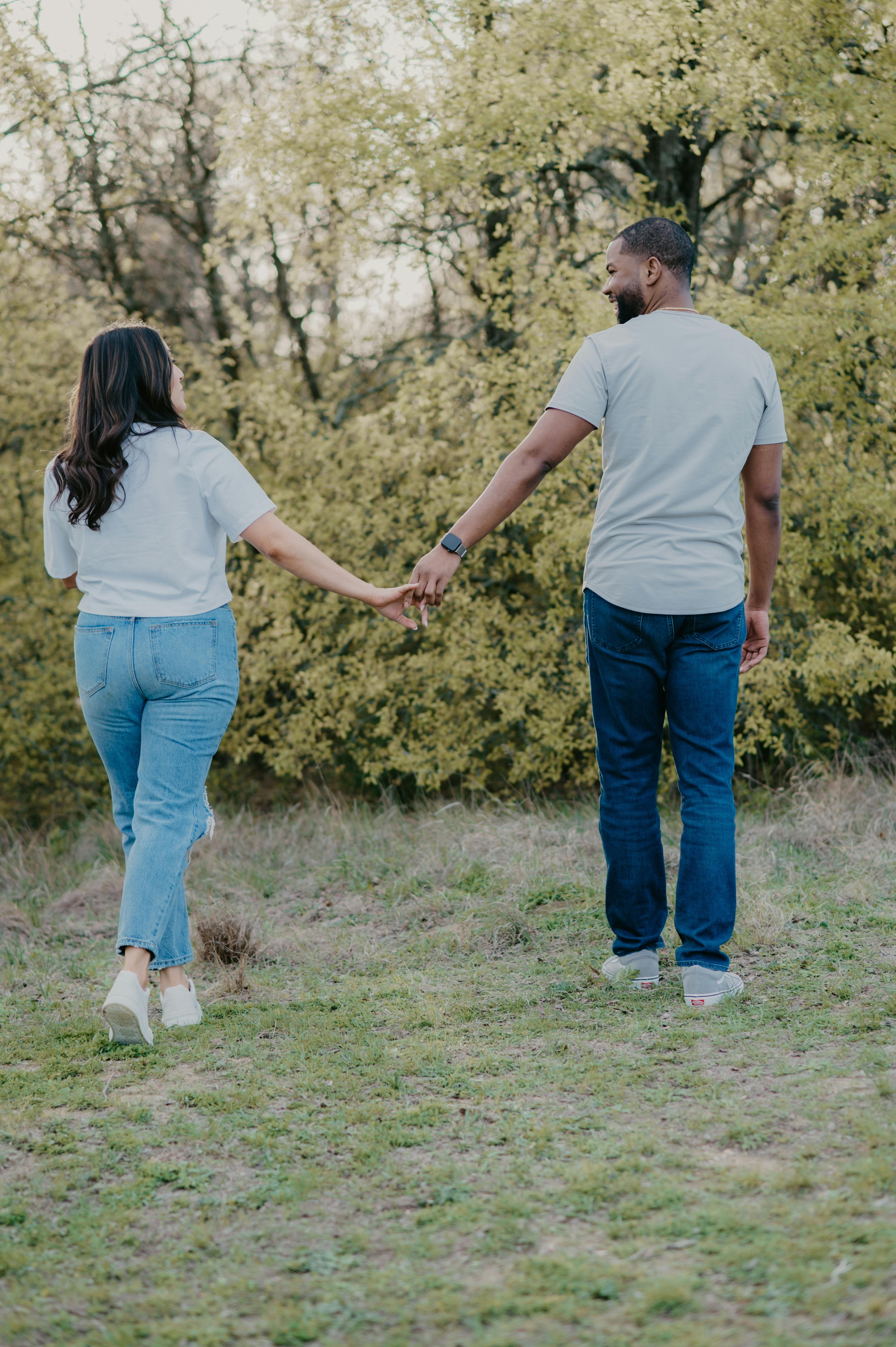 Couple Walking on the Sidewalk · Free Stock Photo