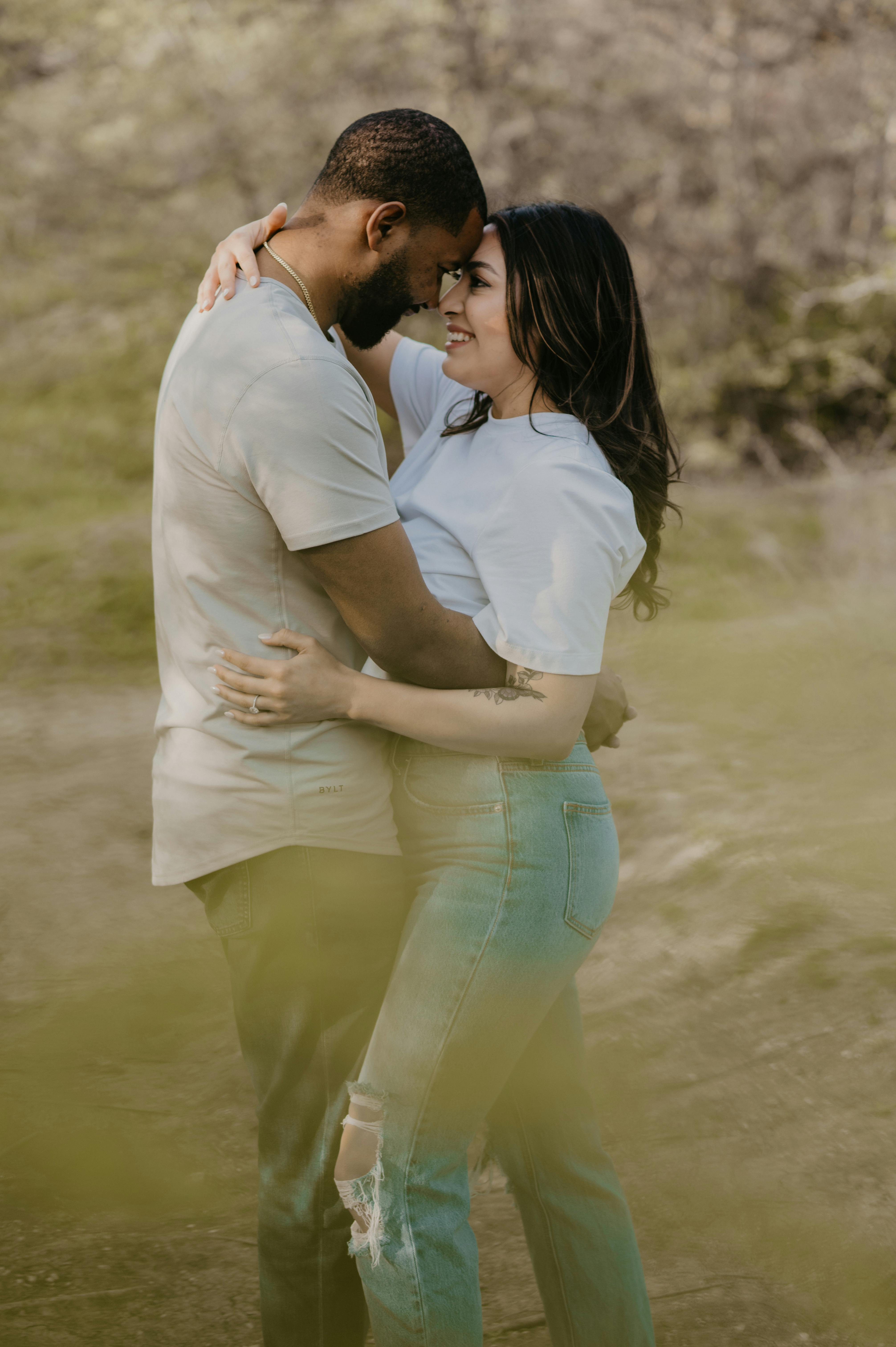 Standing Close Couple Looking at Sunset · Free Stock Photo