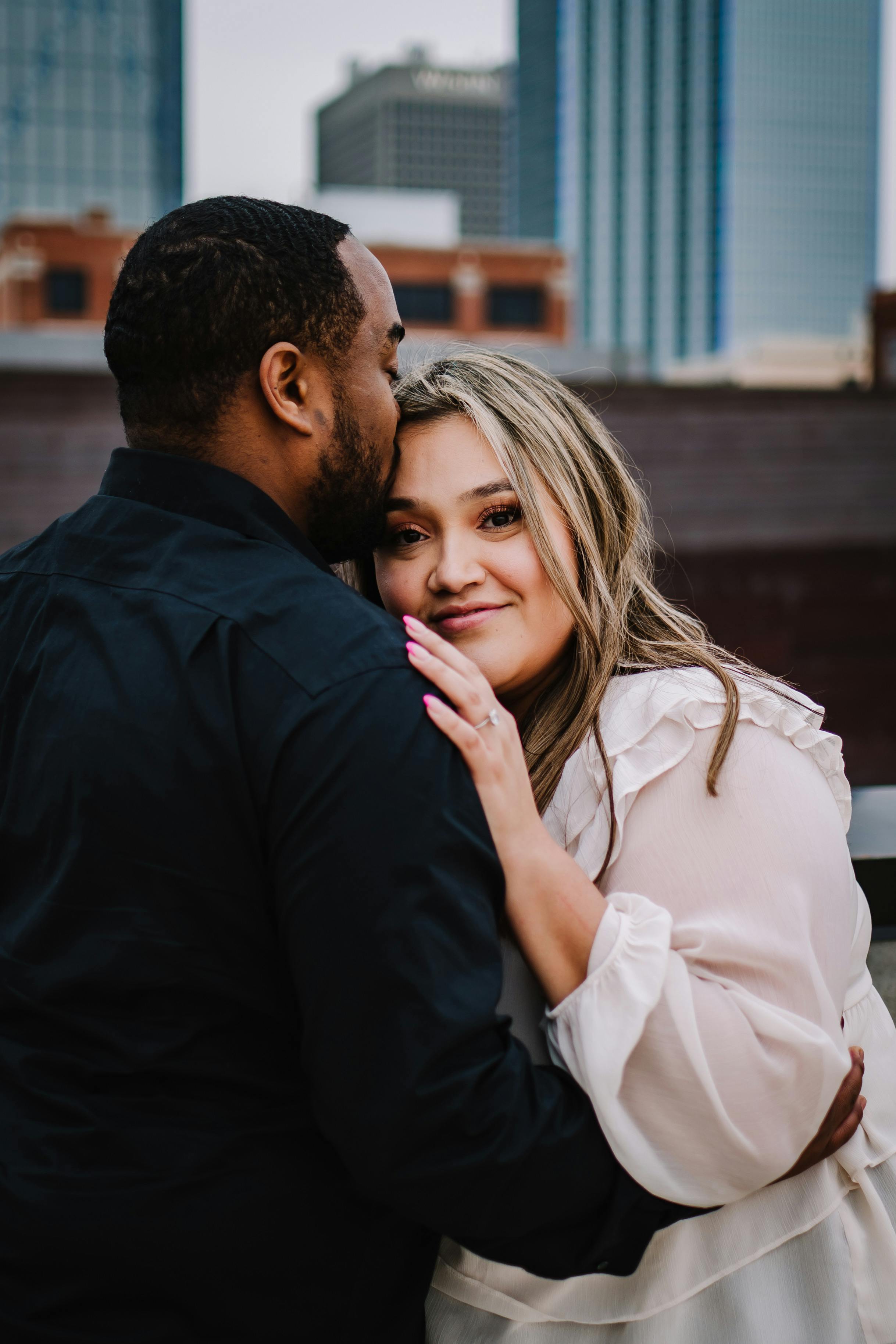 A Couple Hugging and Smiling · Free Stock Photo