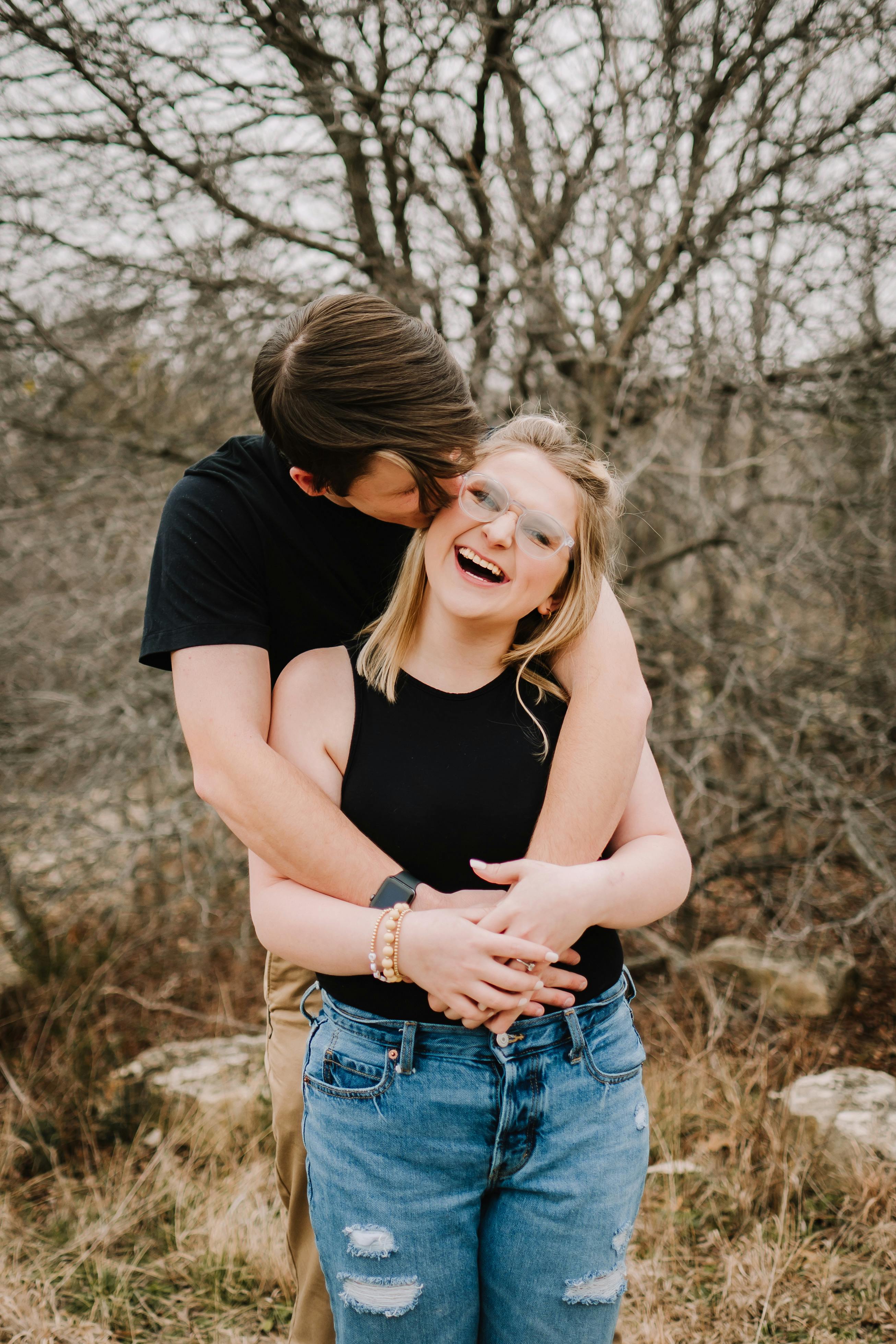 Man Kissing Cheek of his Girlfriend · Free Stock Photo