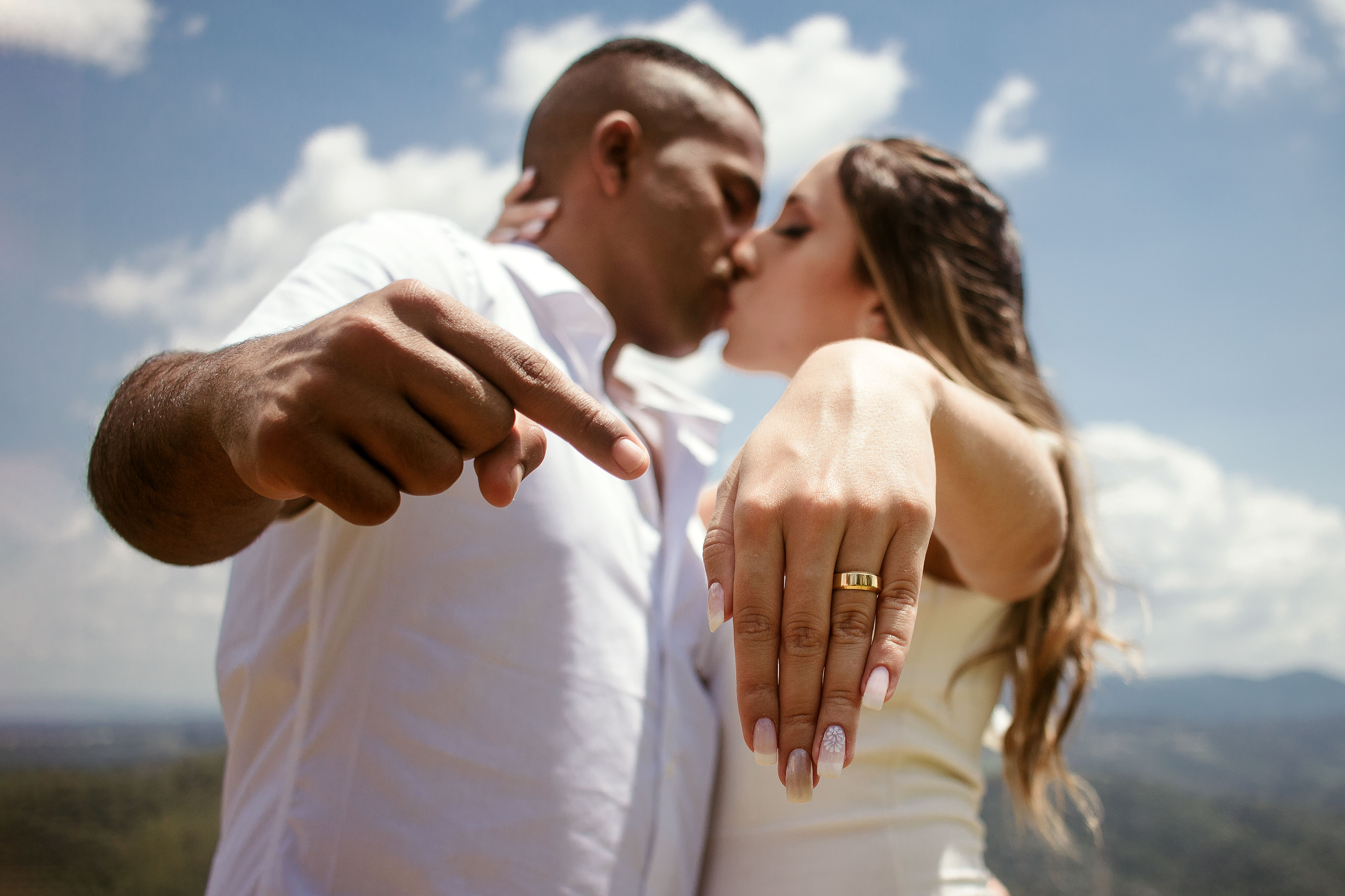 Couple Standing, Kissing and Holding Hands · Free Stock Photo